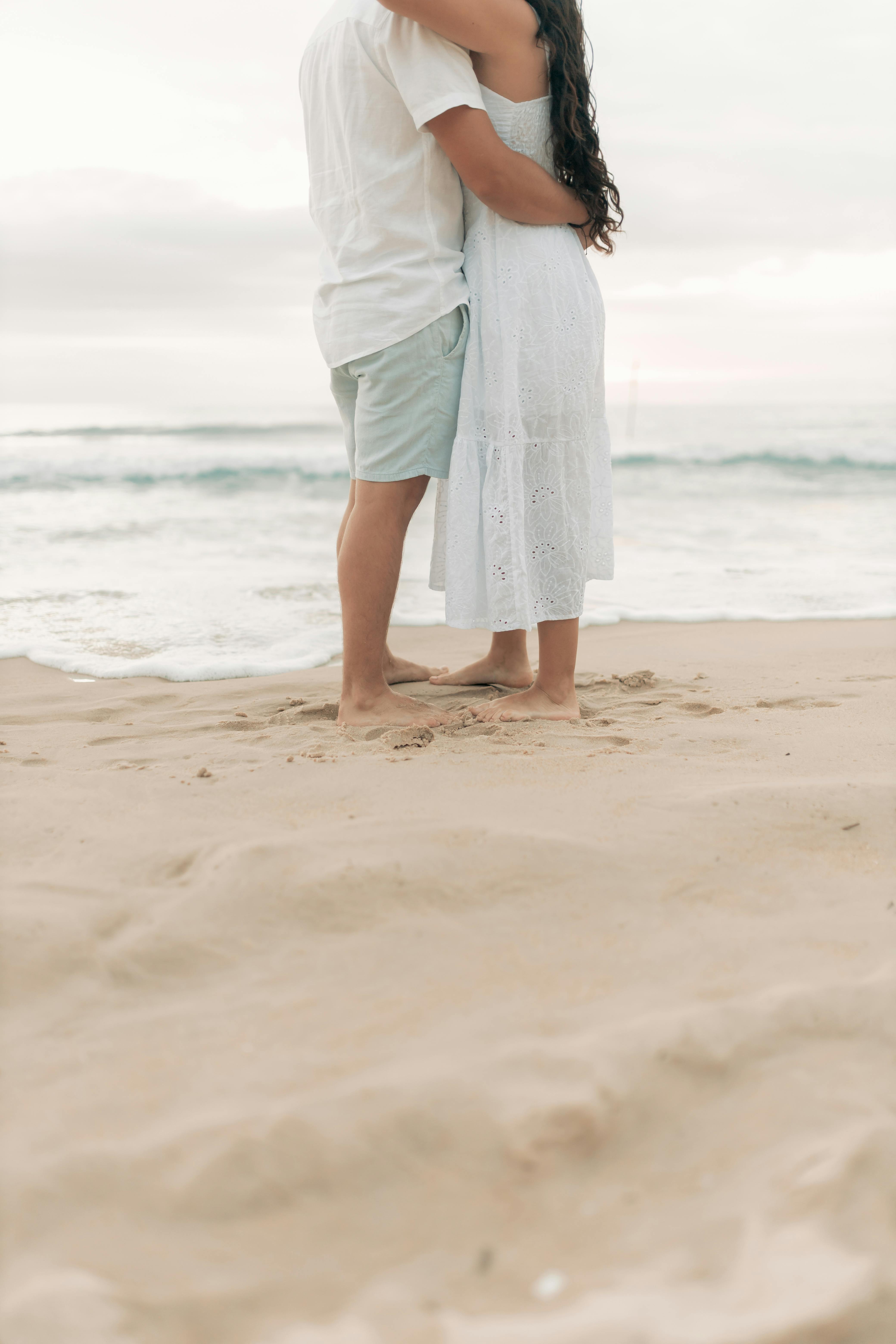 Romantic Beach Embrace at Sunrise · Free Stock Photo