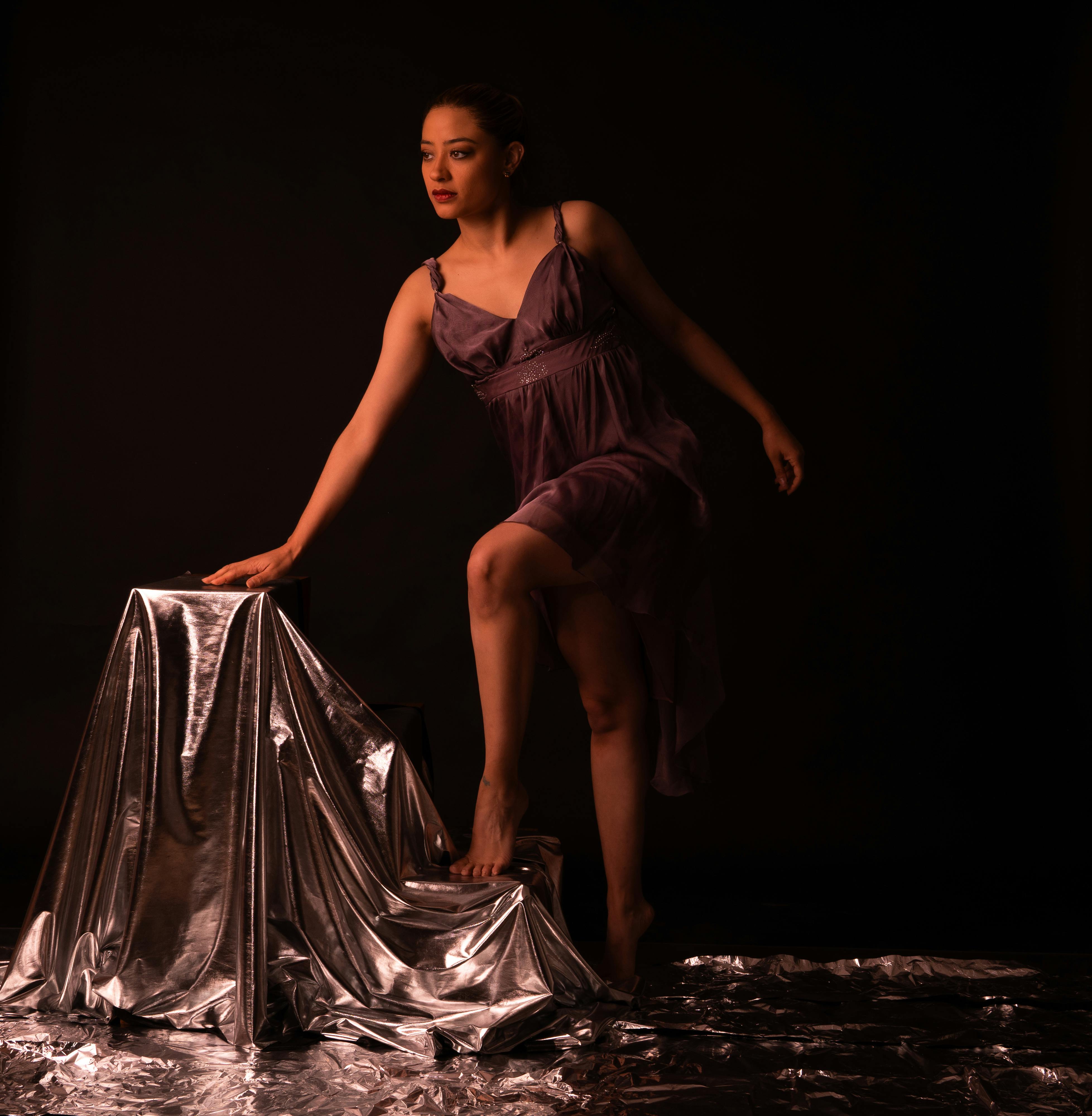 Elegant Female Dancer in Dramatic Studio Lighting · Free Stock Photo