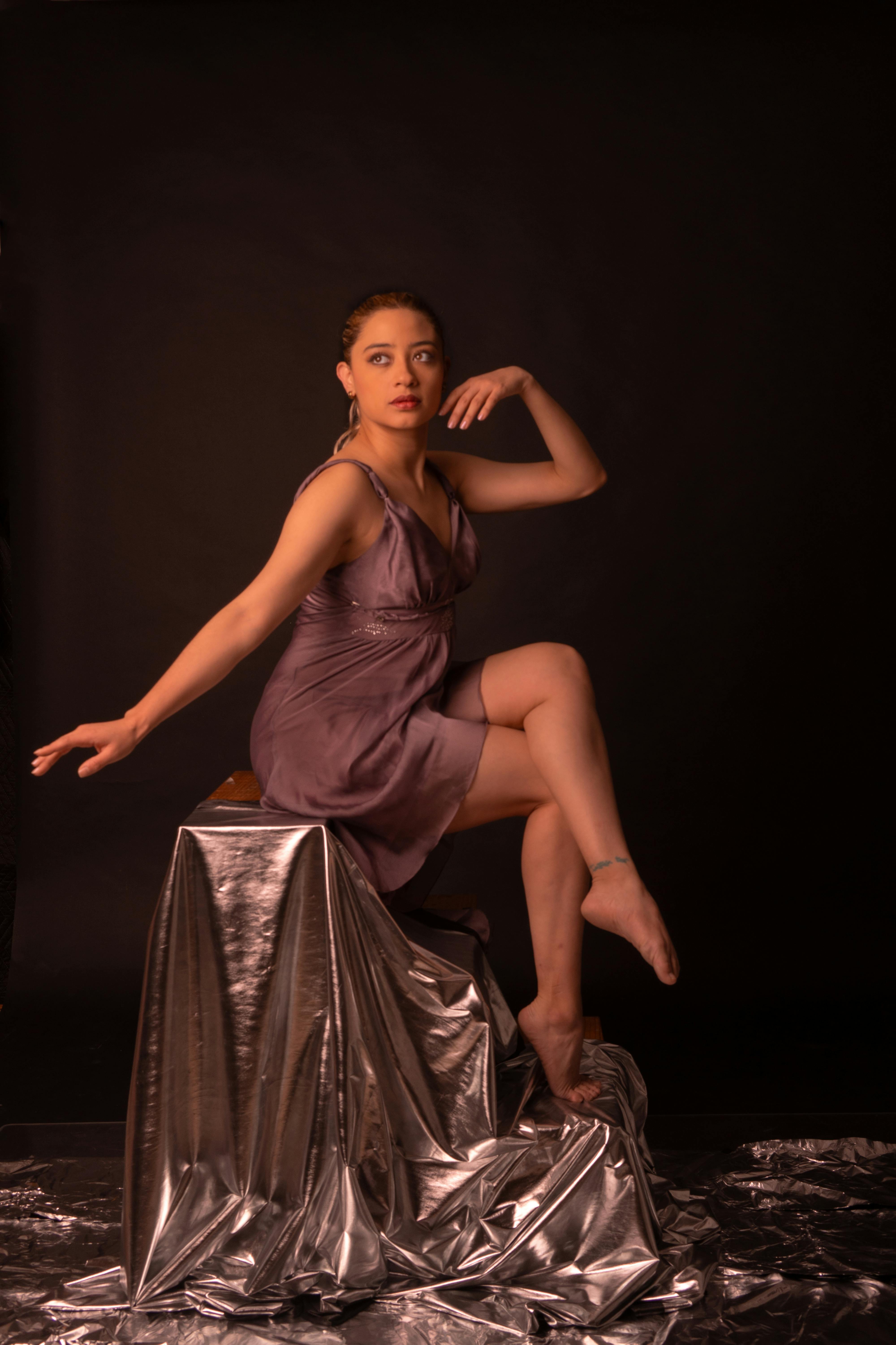 Elegant Female Dancer in Artistic Pose on Stage · Free Stock Photo