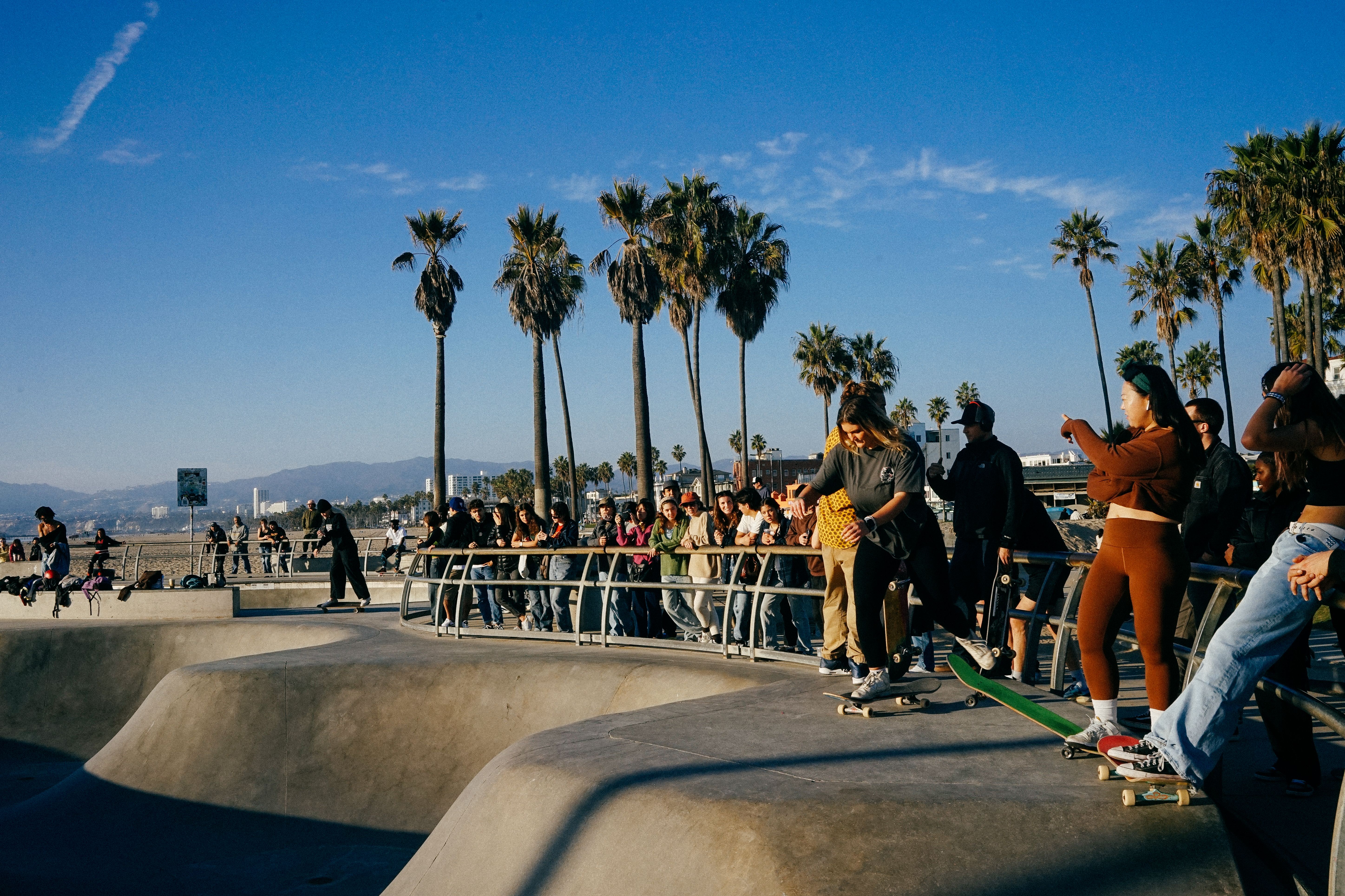 Skateboarders Performing Tricks at Venice Beach · Free Stock Photo
