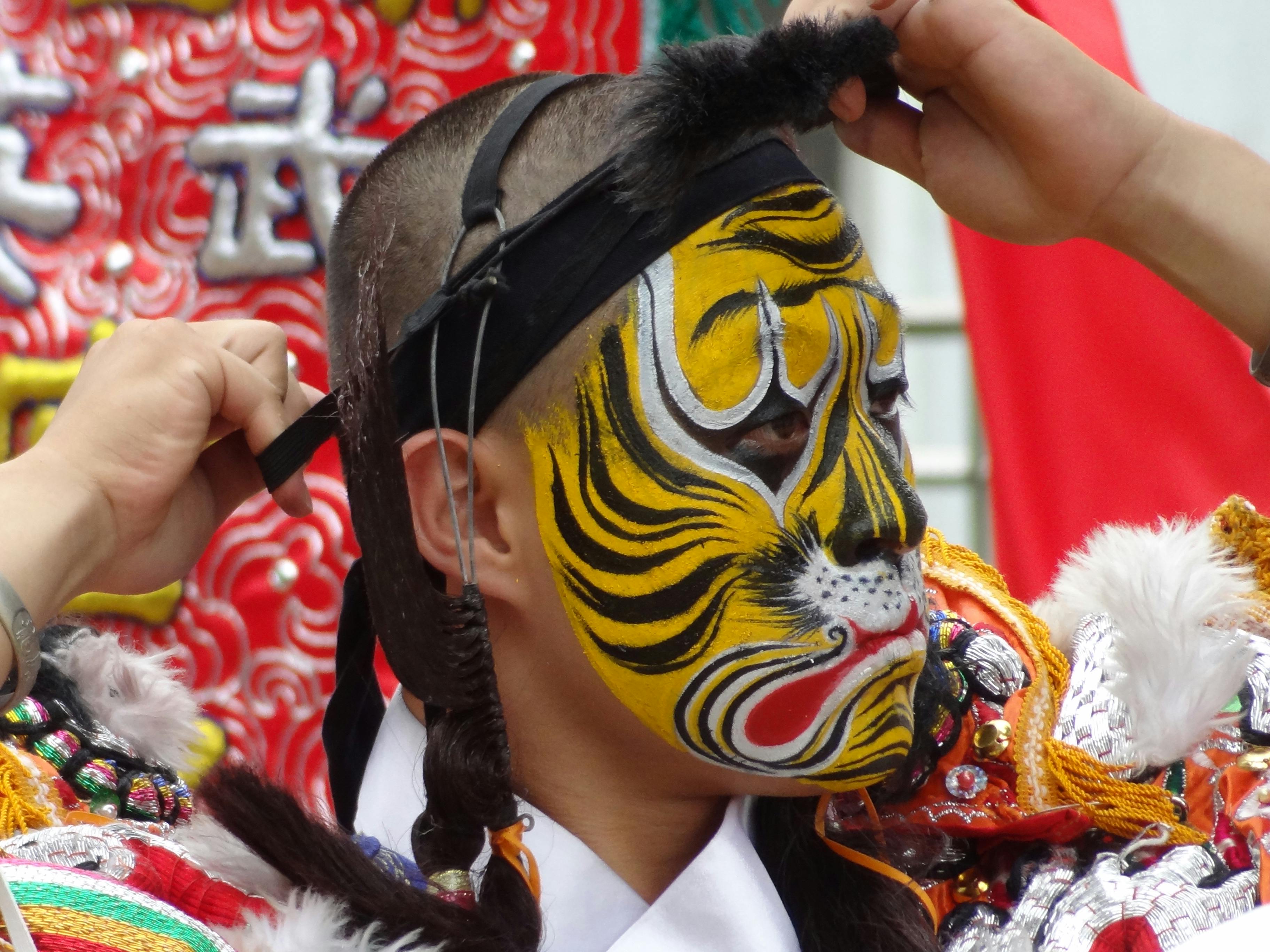 Vibrant Traditional Face Painting in Cultural Parade · Free Stock Photo