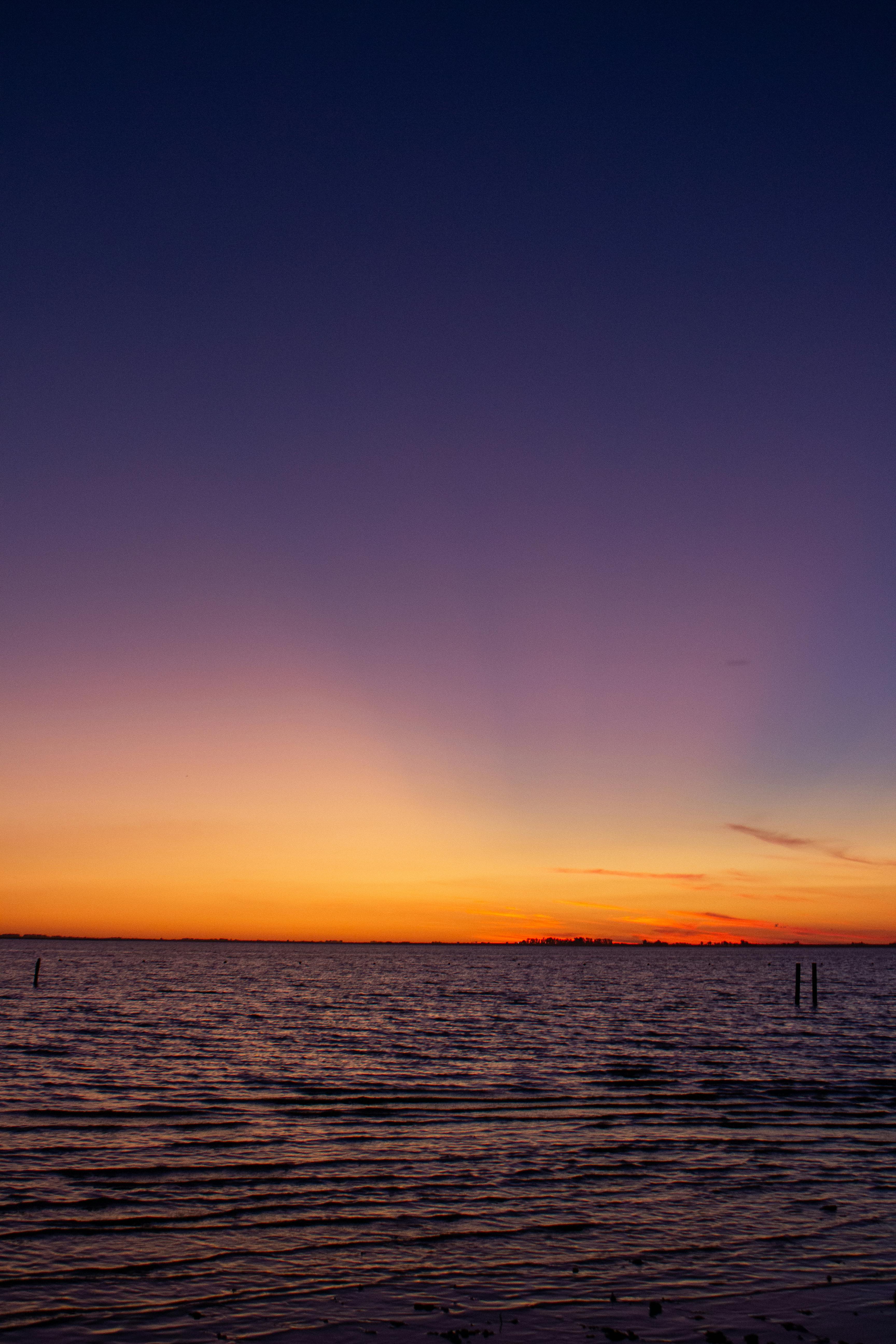 Stunning Ocean Sunset with Vibrant Sky · Free Stock Photo