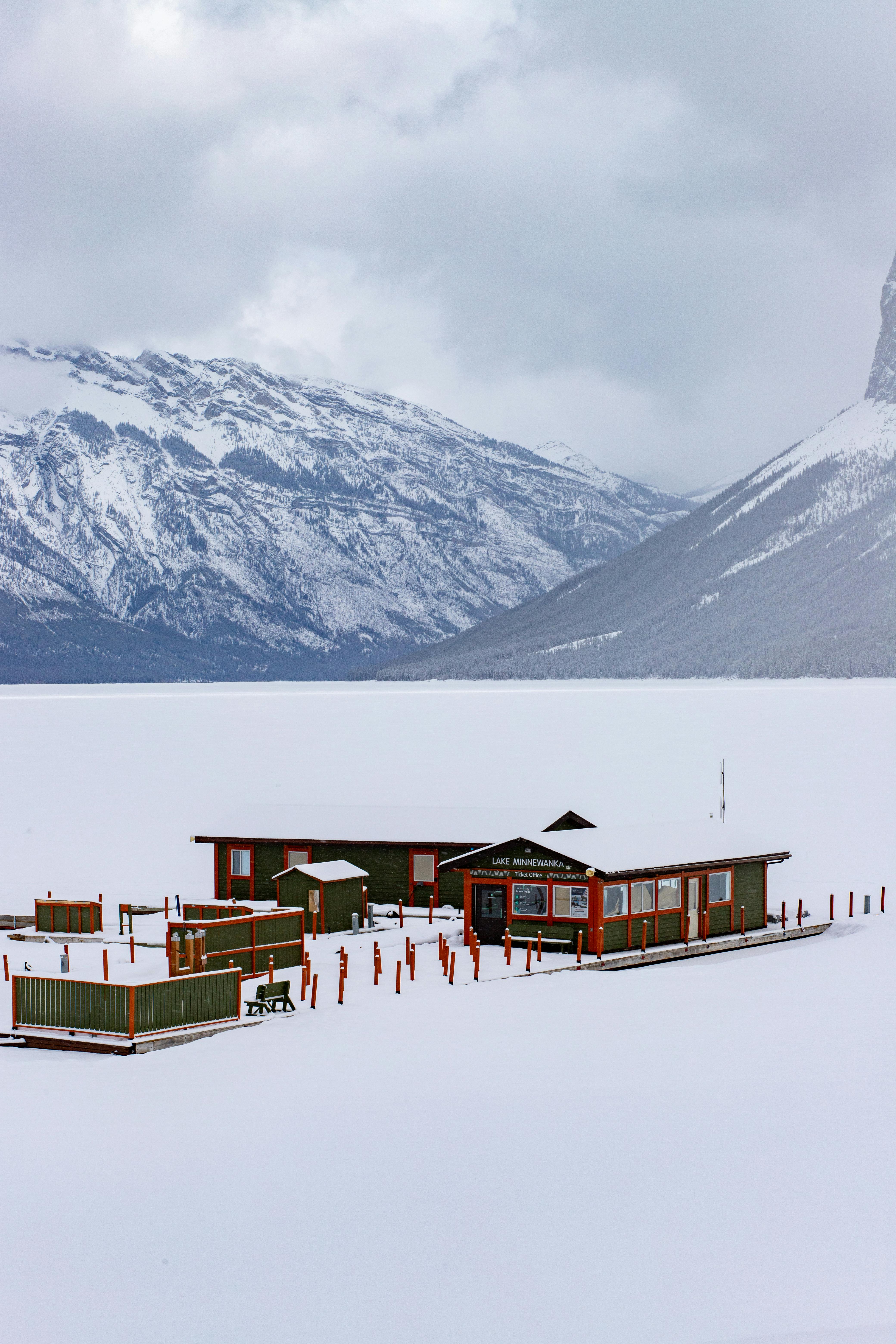 Remote Snowy Shack in Rocky Mountain Landscape · Free Stock Photo