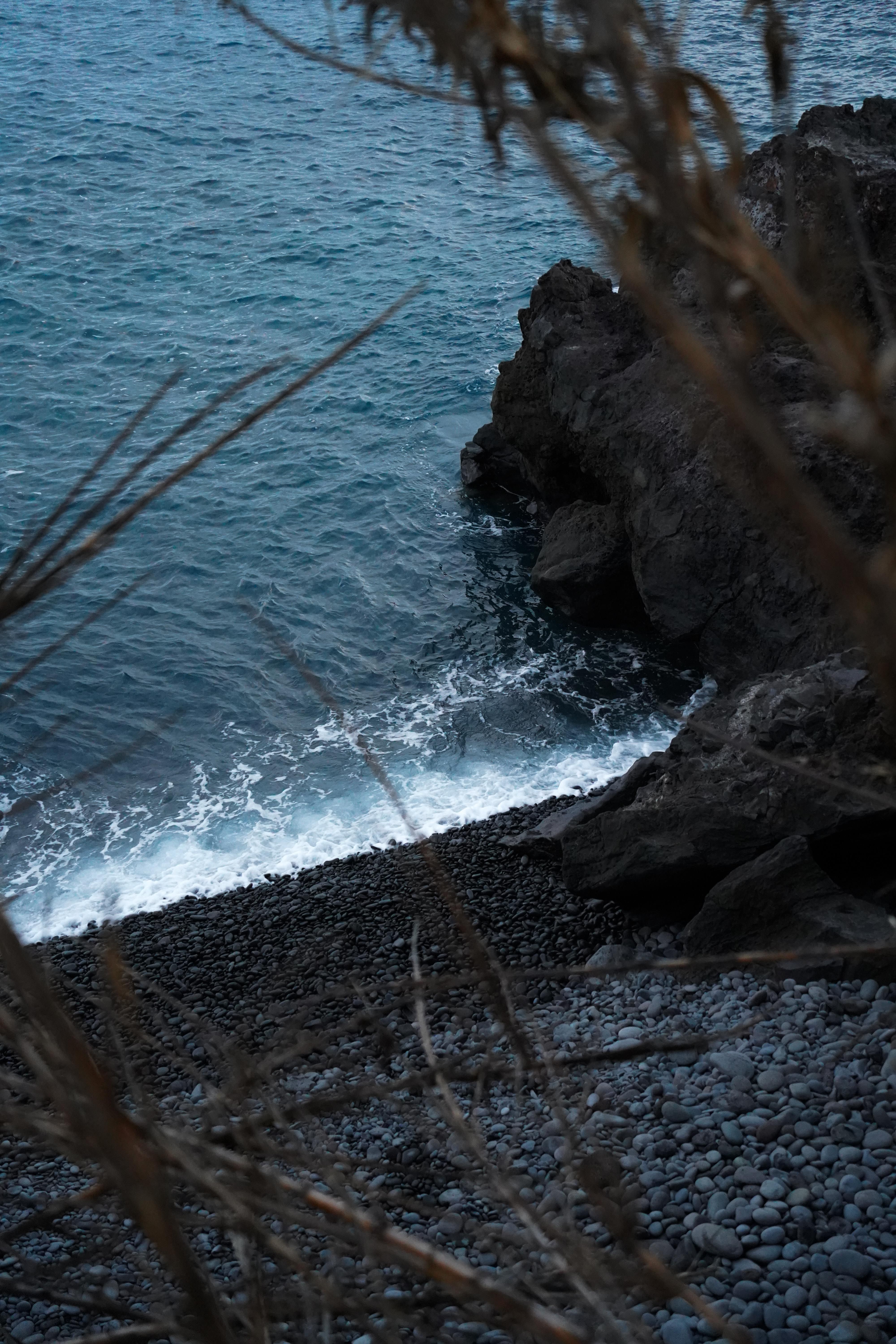 Rocky Shoreline with Blue Ocean Waves · Free Stock Photo