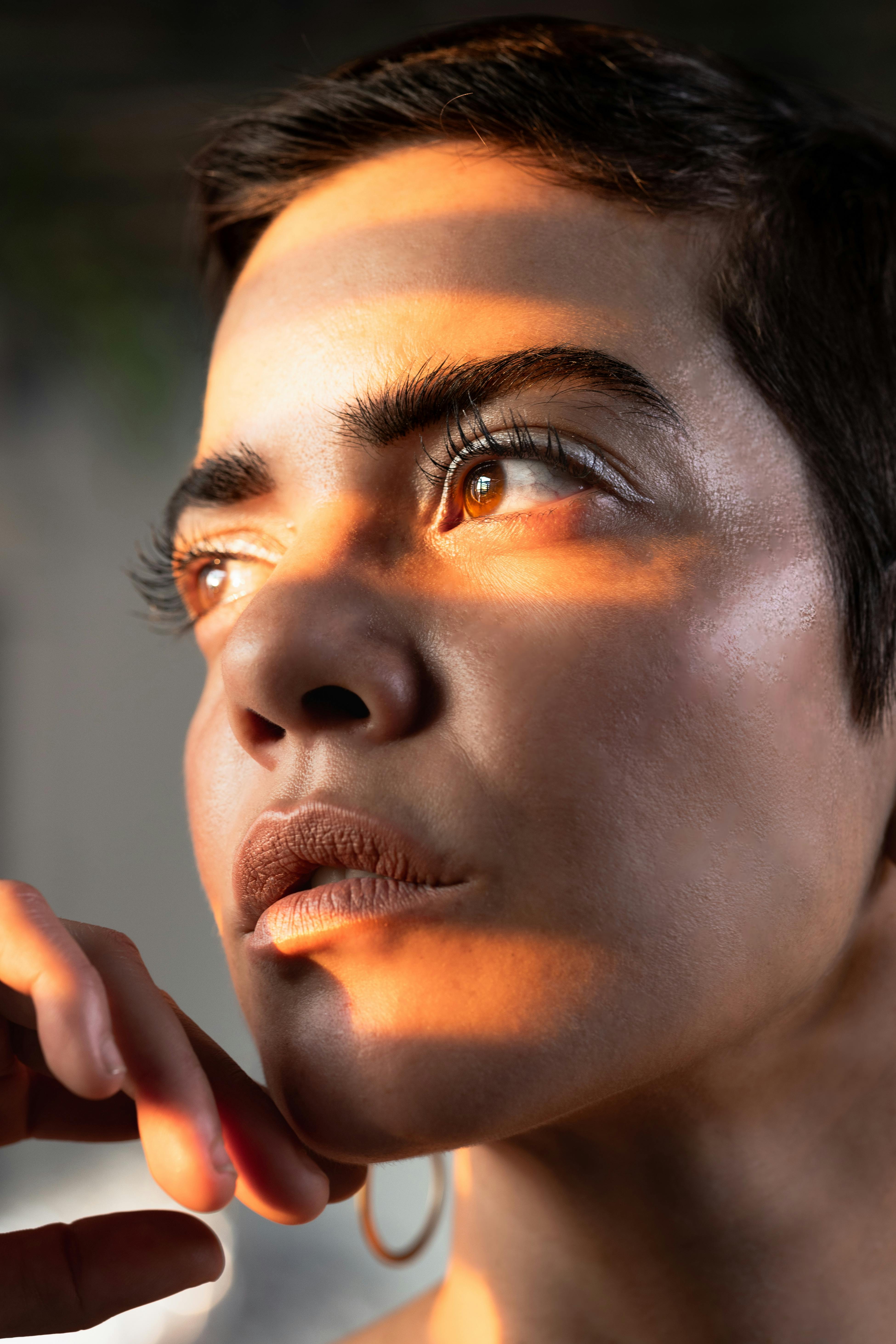 Captivating Close-Up Portrait with Warm Light · Free Stock Photo