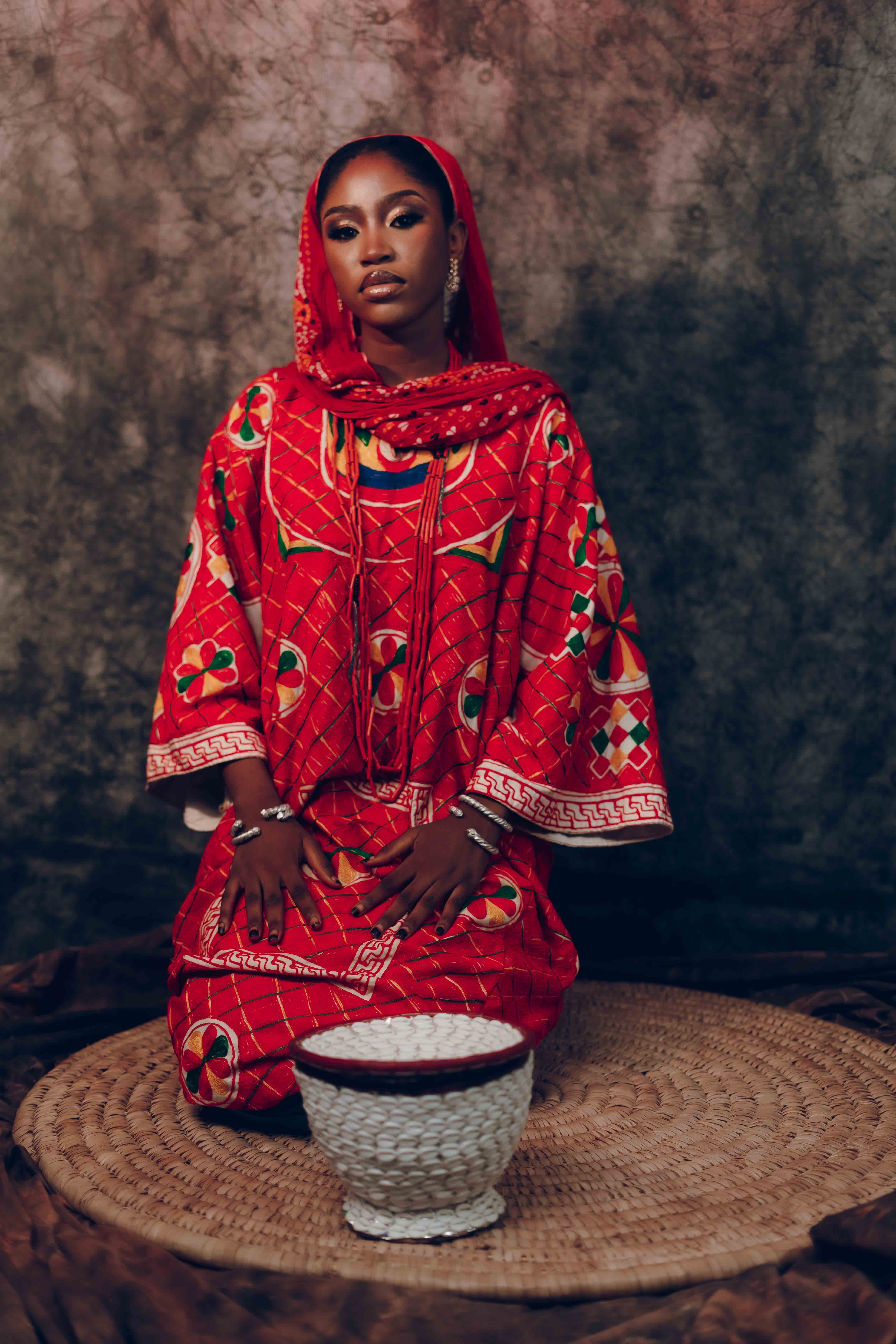 African Woman in Traditional Red Attire · Free Stock Photo