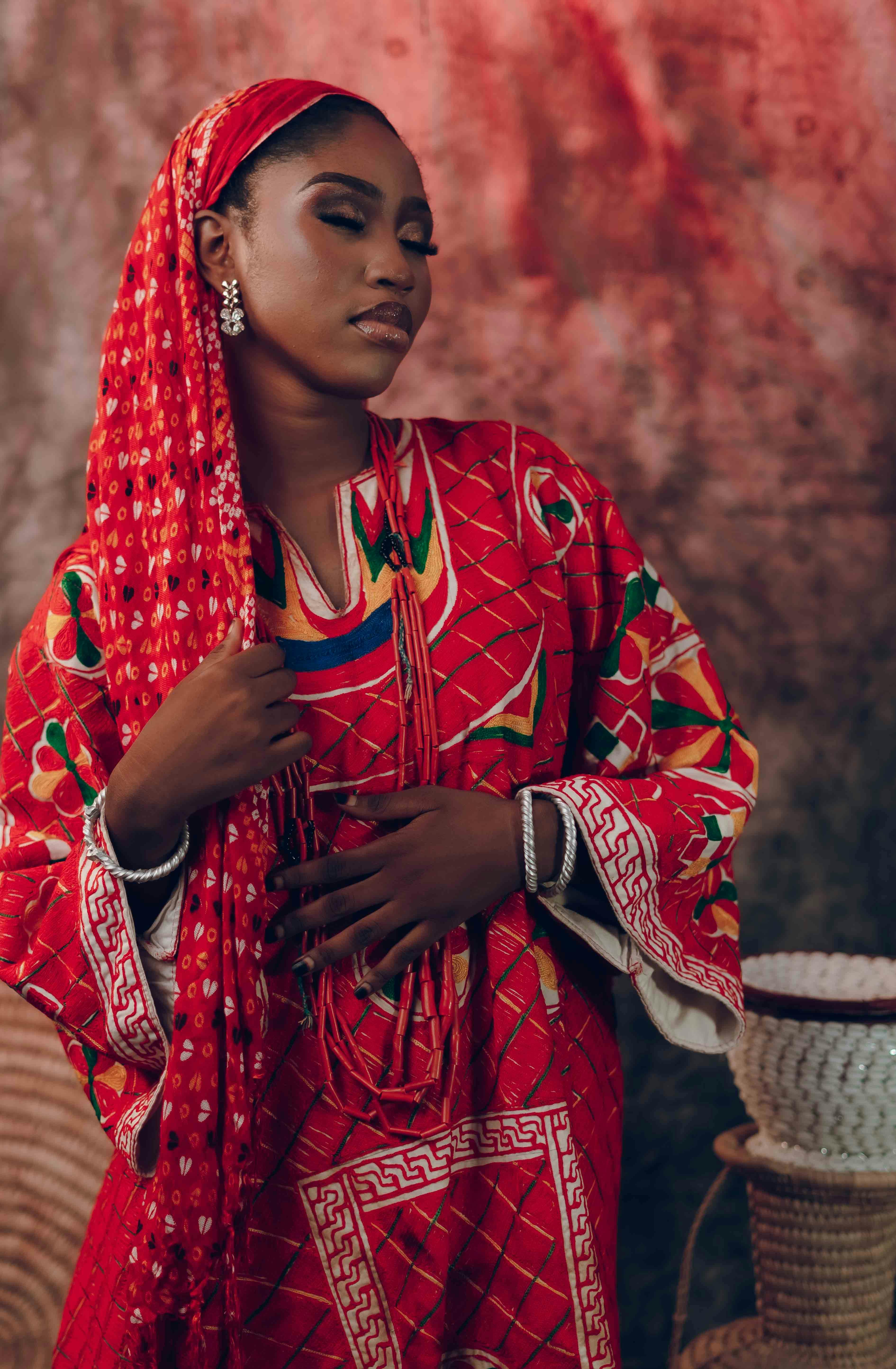 Elegant Woman in Red Traditional Attire · Free Stock Photo