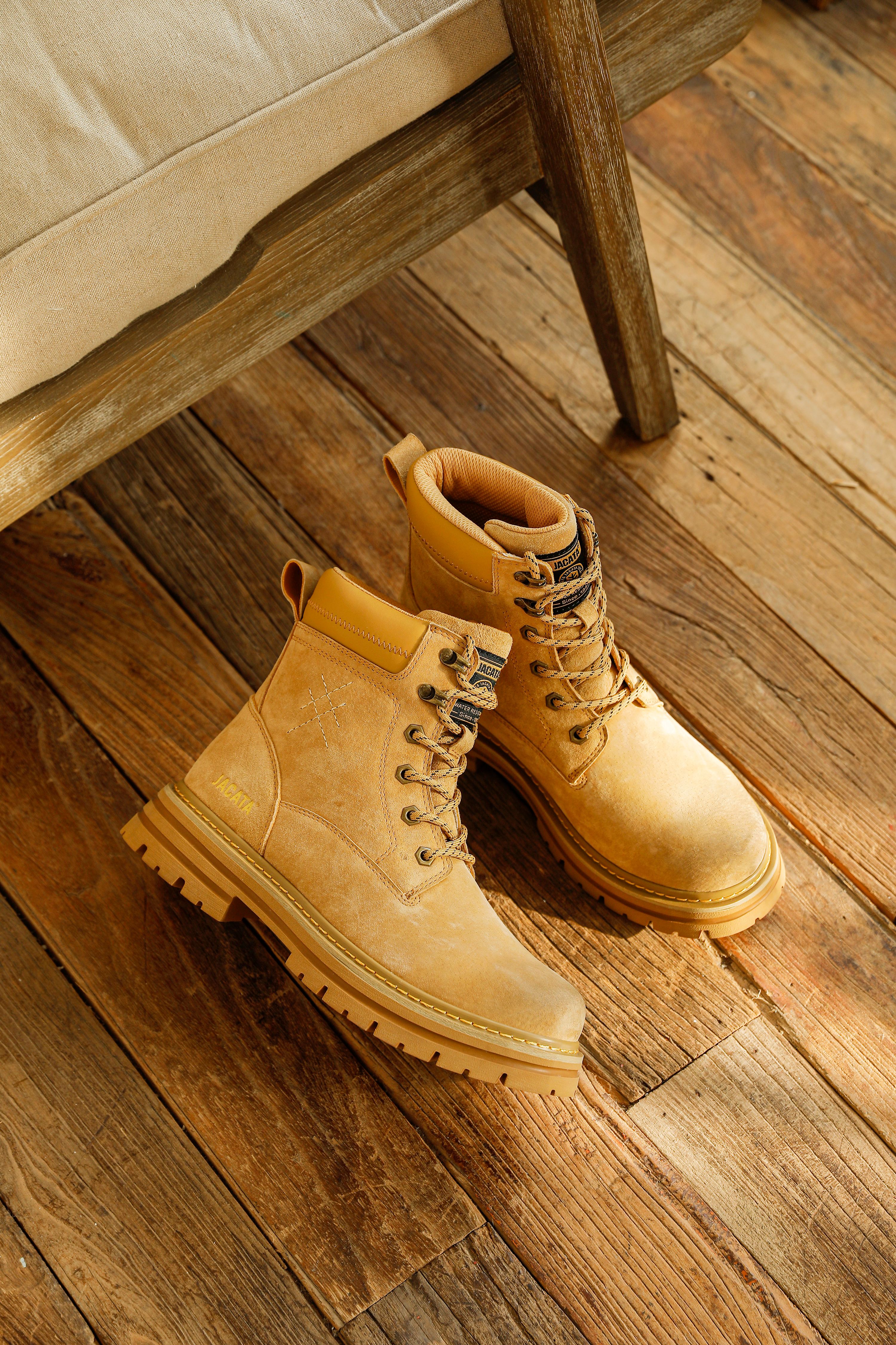 Pair of Tan Leather Boots on Wooden Floor · Free Stock Photo