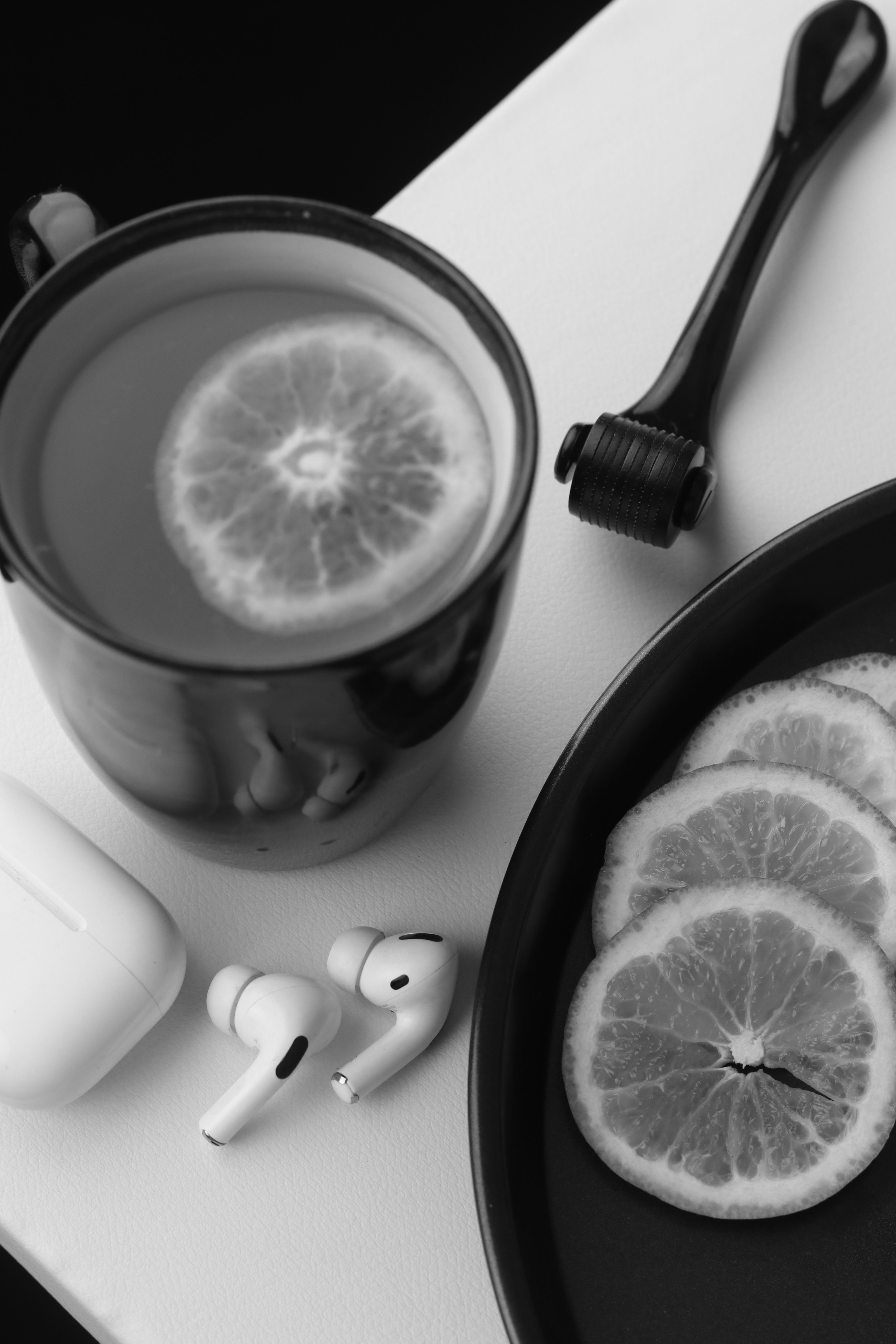 Monochrome Still Life with Citrus and Gadgets · Free Stock Photo