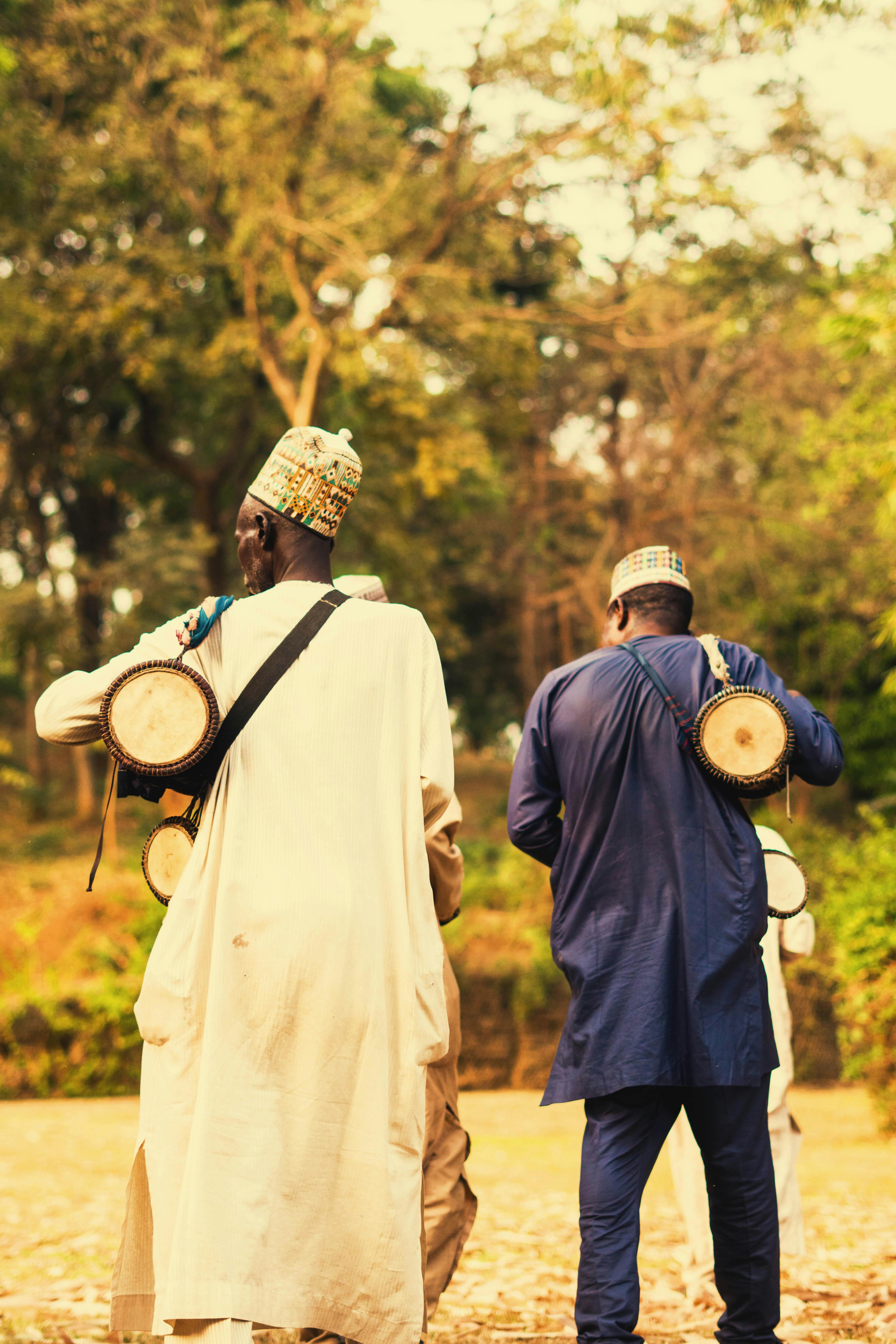 Traditional Drummers Walking in Forest Path · Free Stock Photo