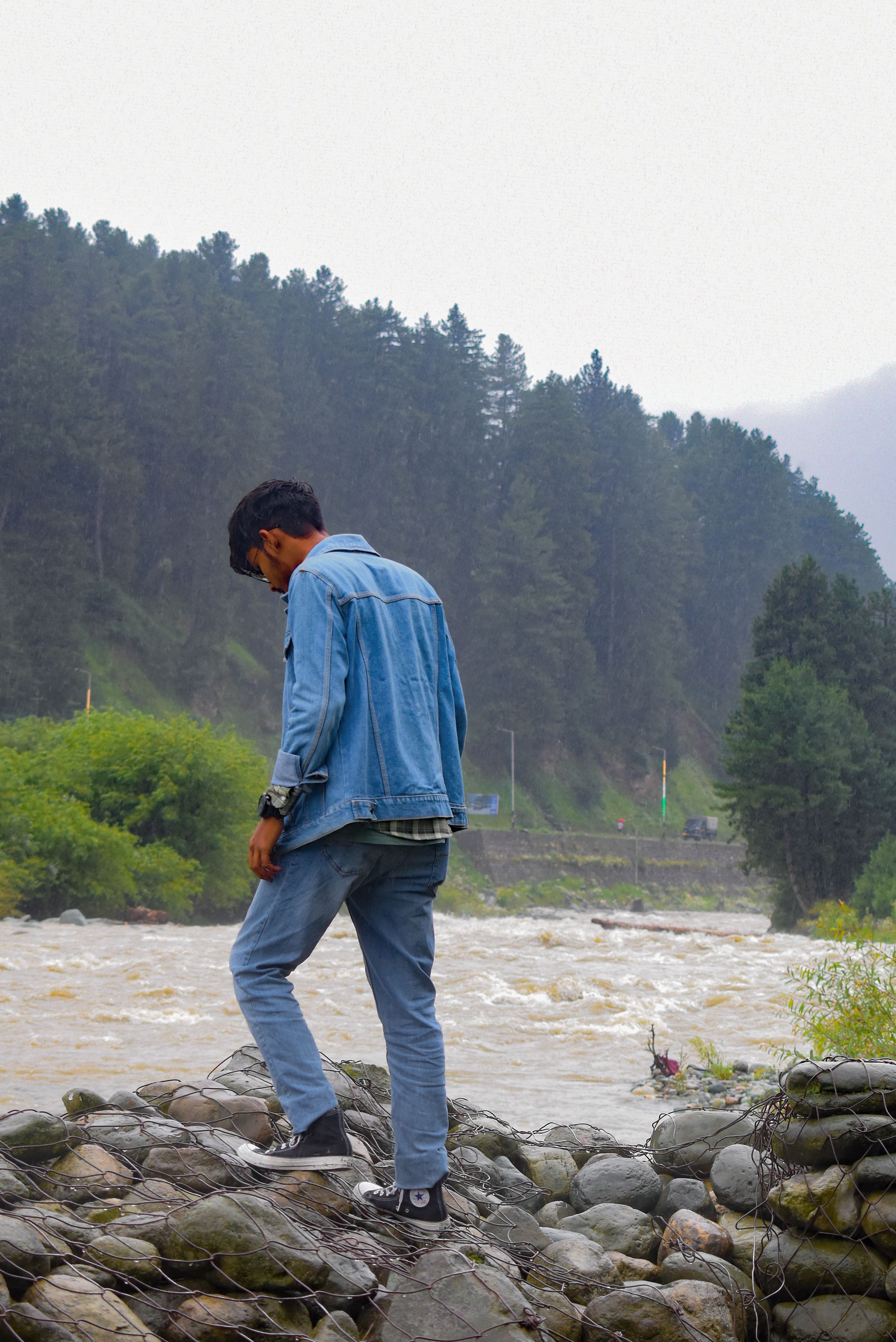 Man Walking by River in Kashmir's Scenic Wilderness · Free Stock Photo