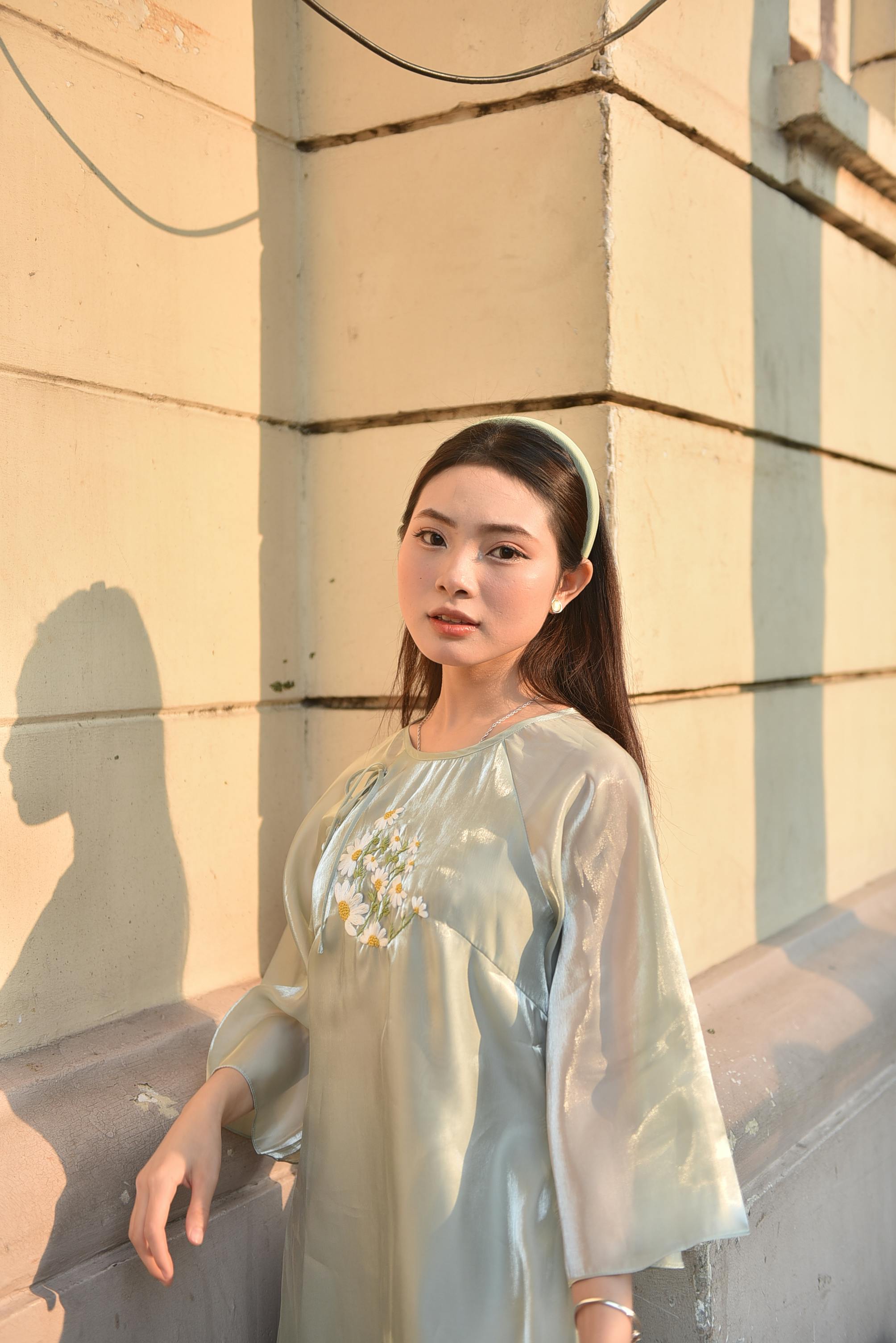 Sunlit Portrait of Young Woman by Urban Wall · Free Stock Photo