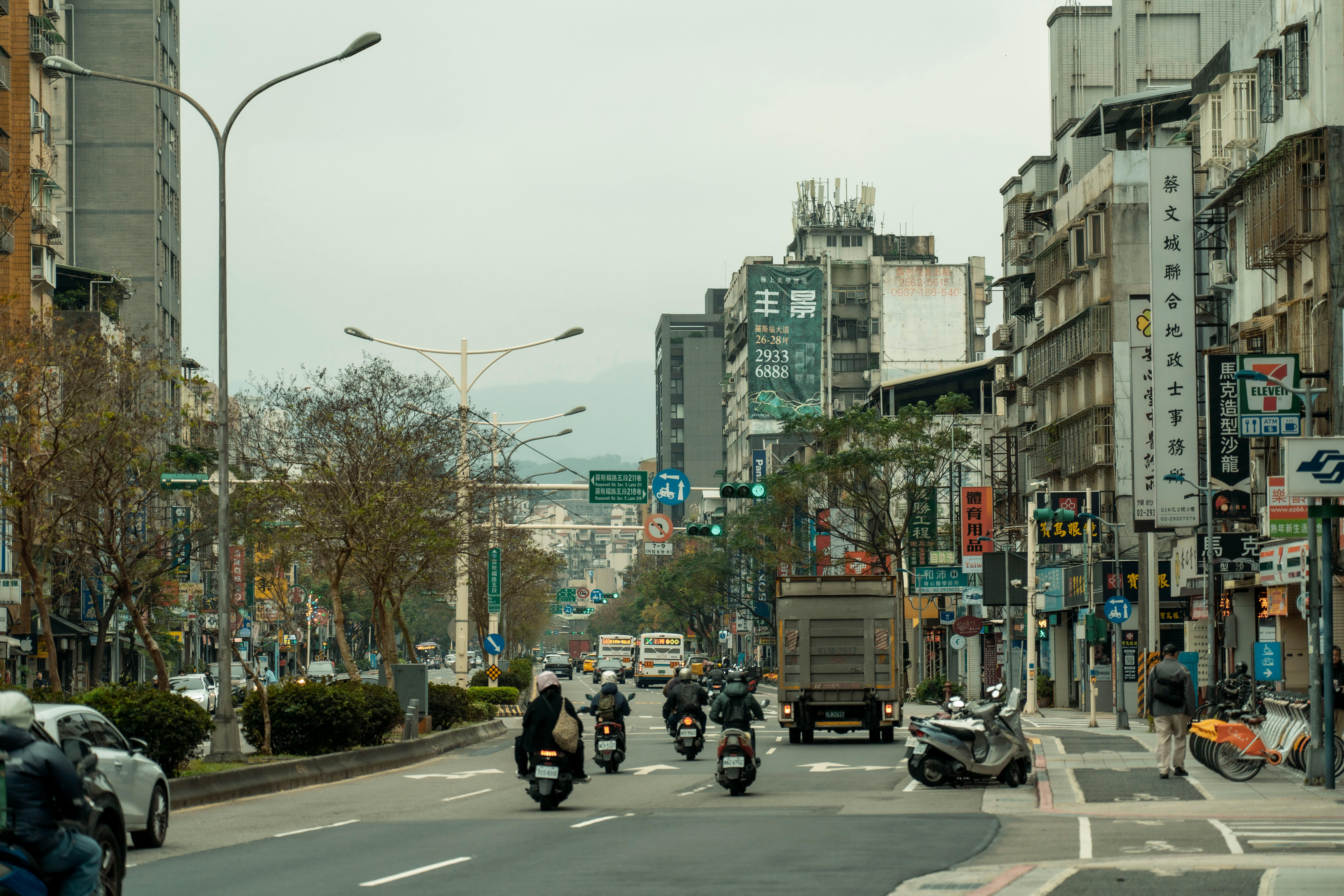 Busy Taipei Street Scene with Motorbikes and Traffic · Free Stock Photo