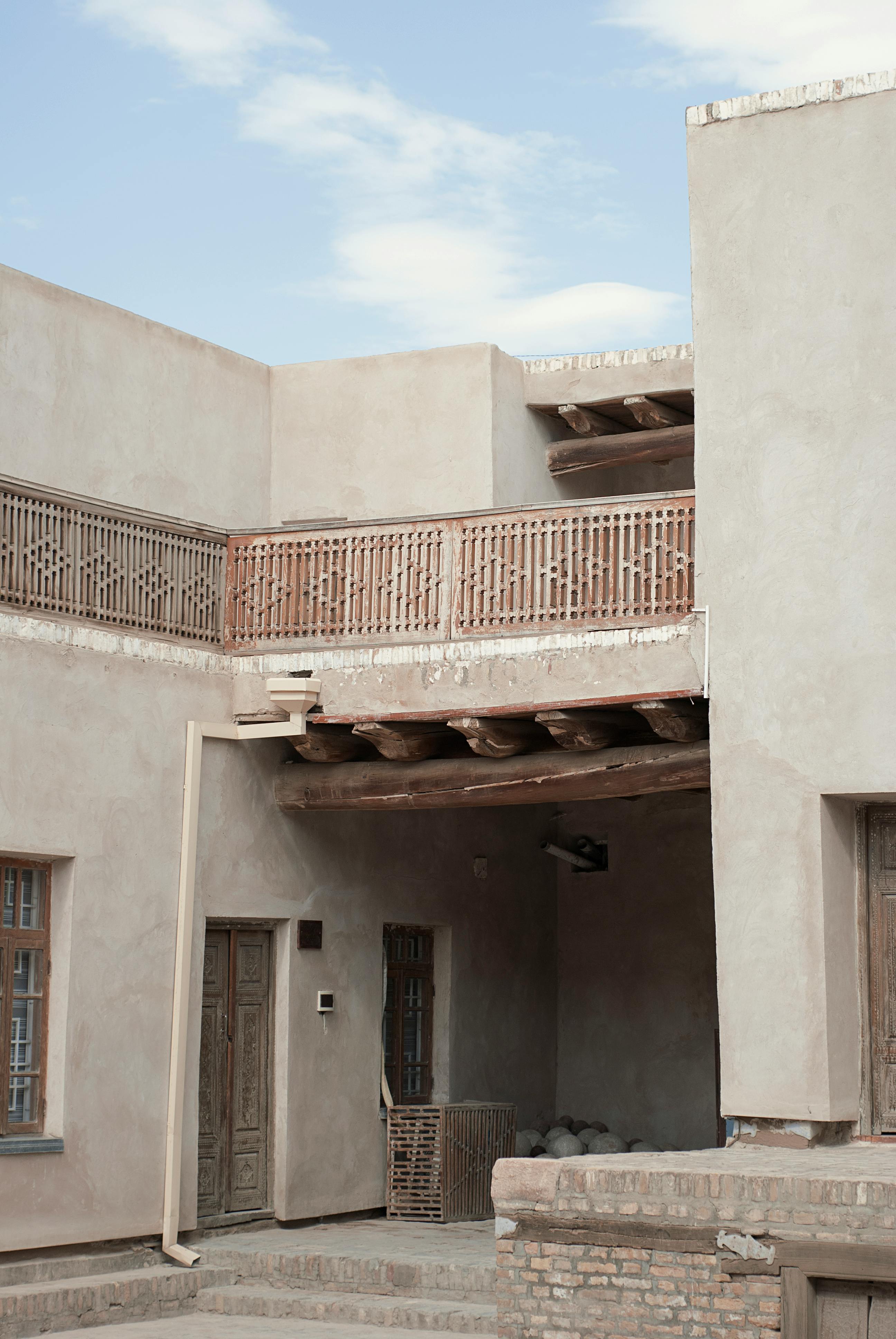 Rustic Adobe House Exteriors with Wooden Accents · Free Stock Photo