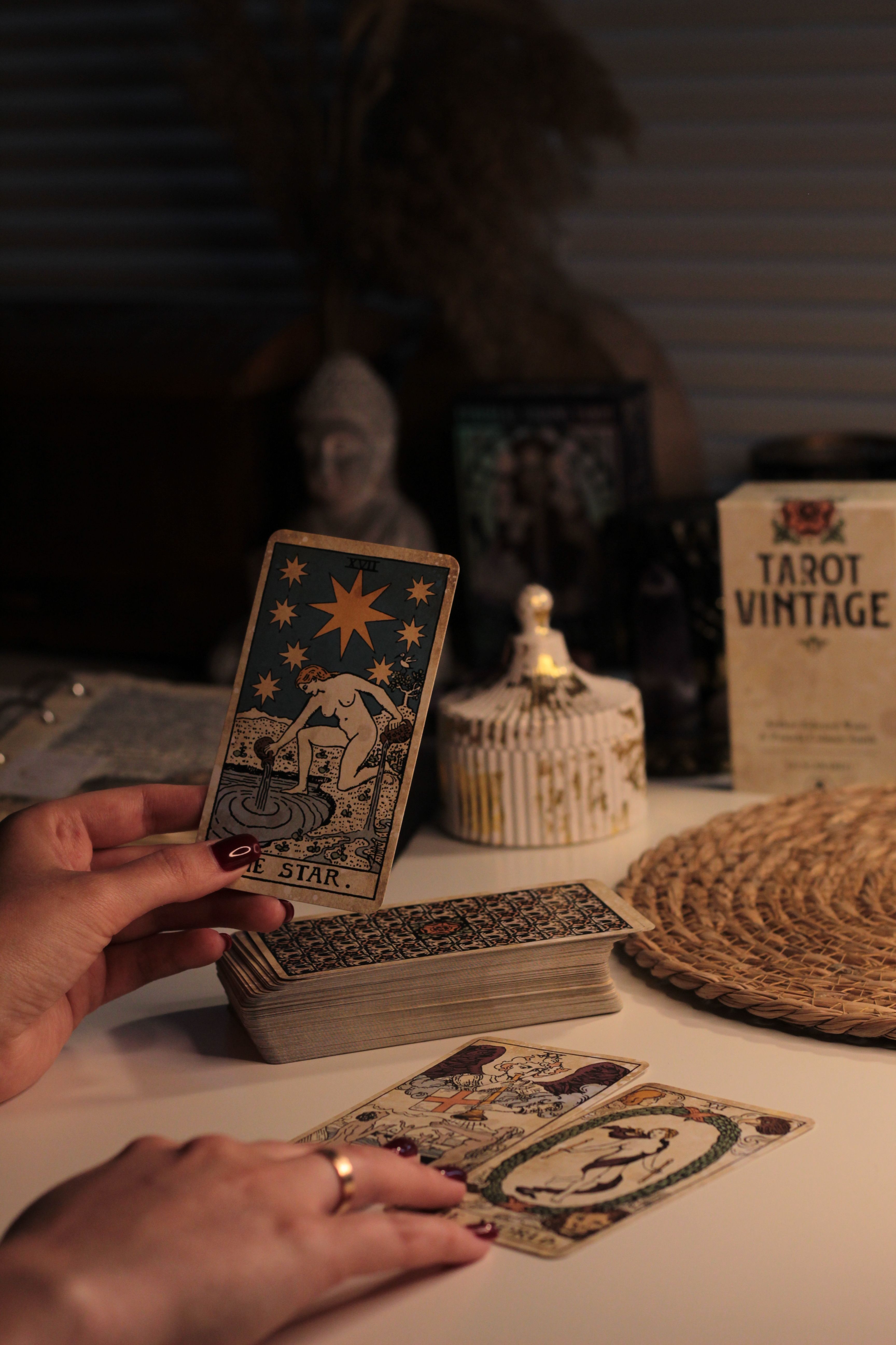 Vintage Tarot Reading Session with Card Display · Free Stock Photo