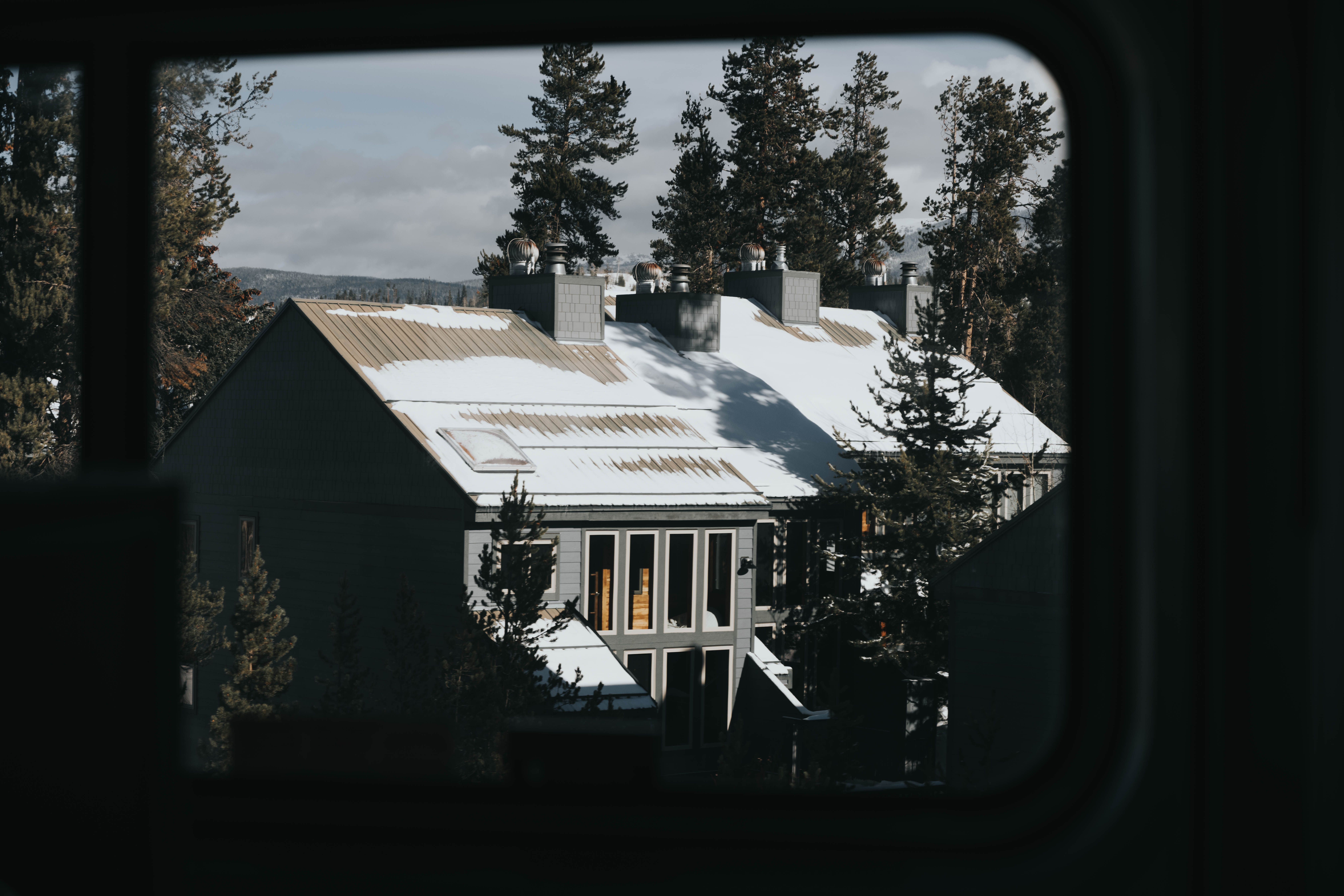 Snow-Covered House in Winter Forest · Free Stock Photo