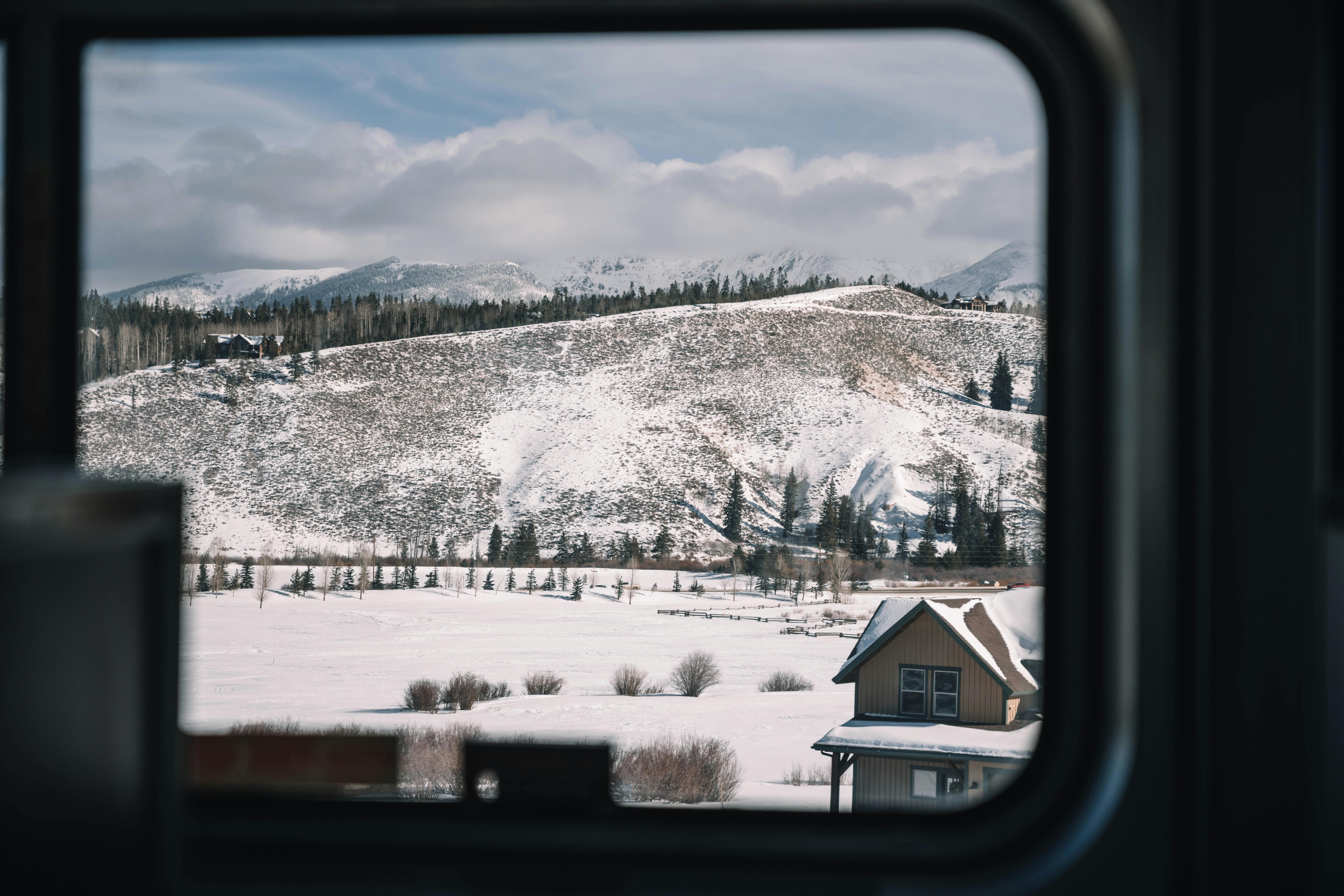 Snowy Mountain View Through Window in Colorado · Free Stock Photo