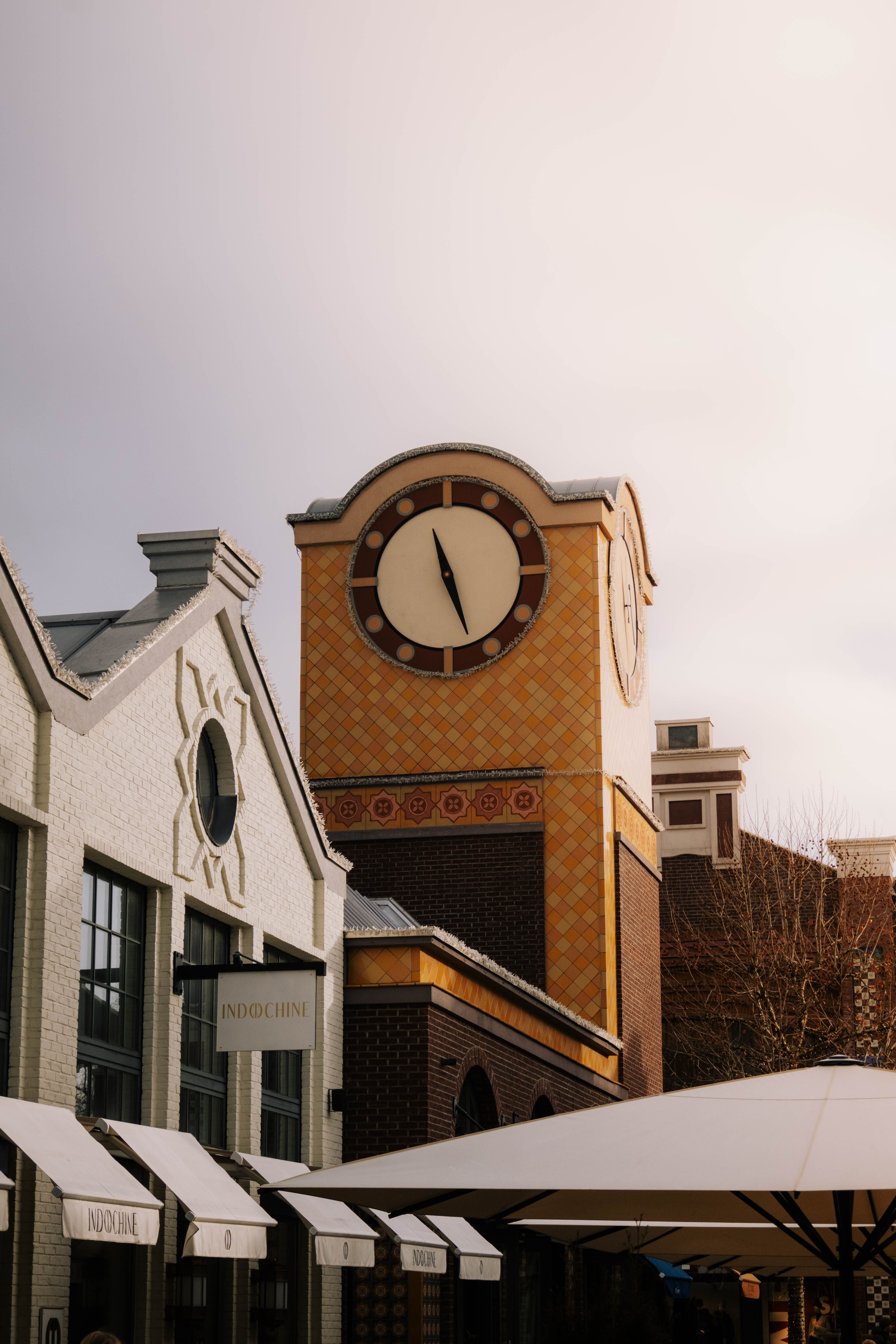 Charming European Clock Tower in Urban Setting · Free Stock Photo