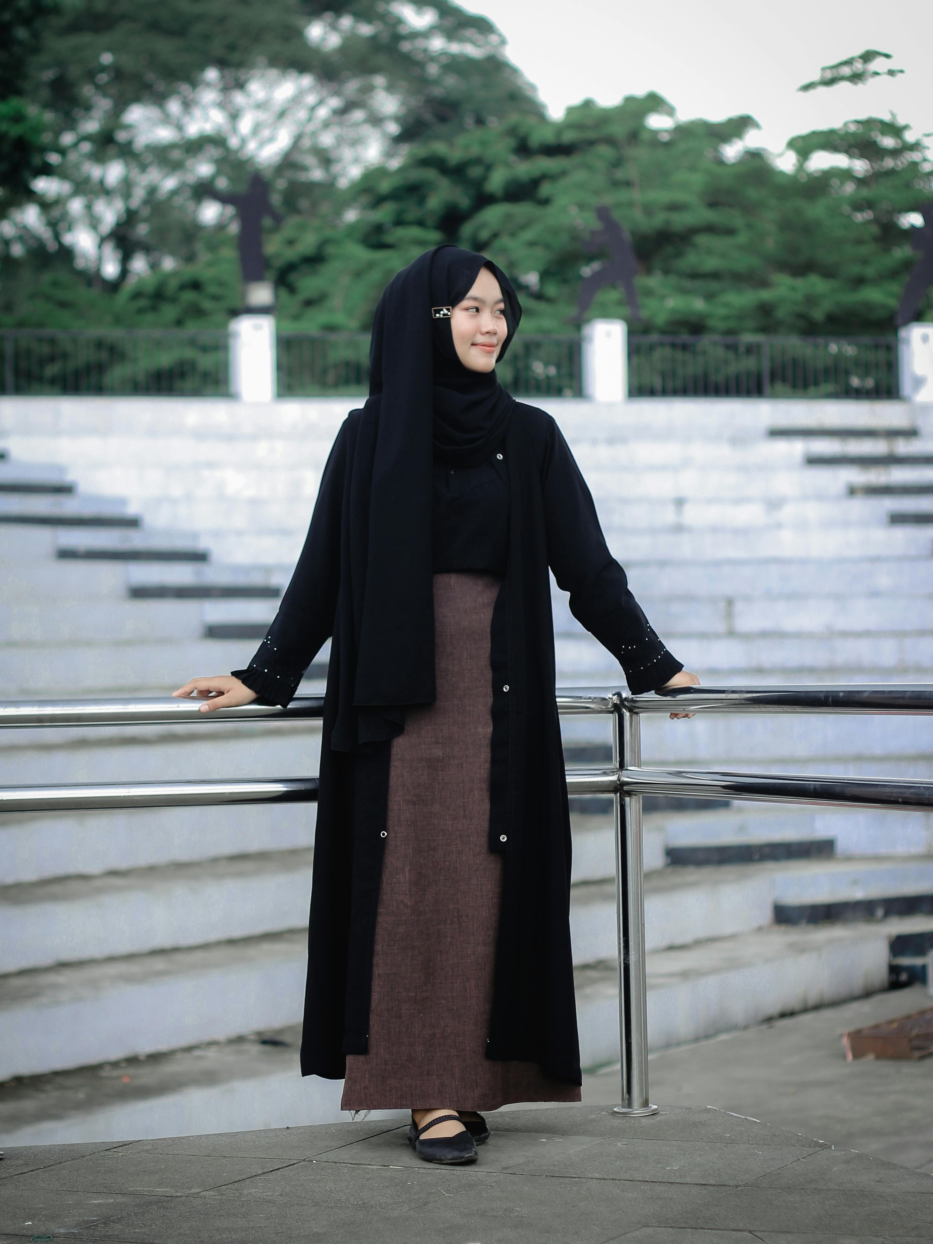 Young Woman in Modest Fashion Outdoors · Free Stock Photo