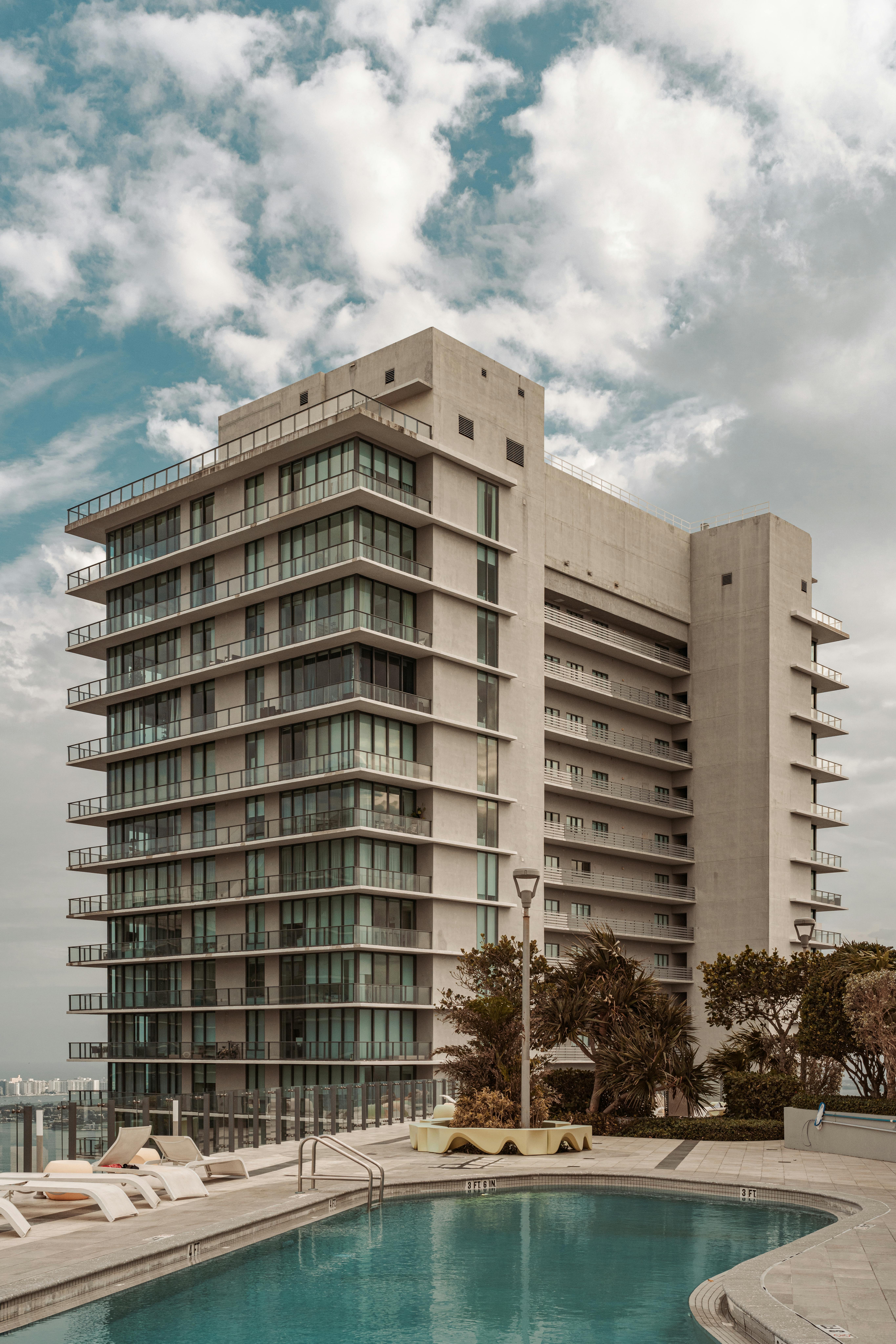 Modern Miami High-Rise with Pool View · Free Stock Photo