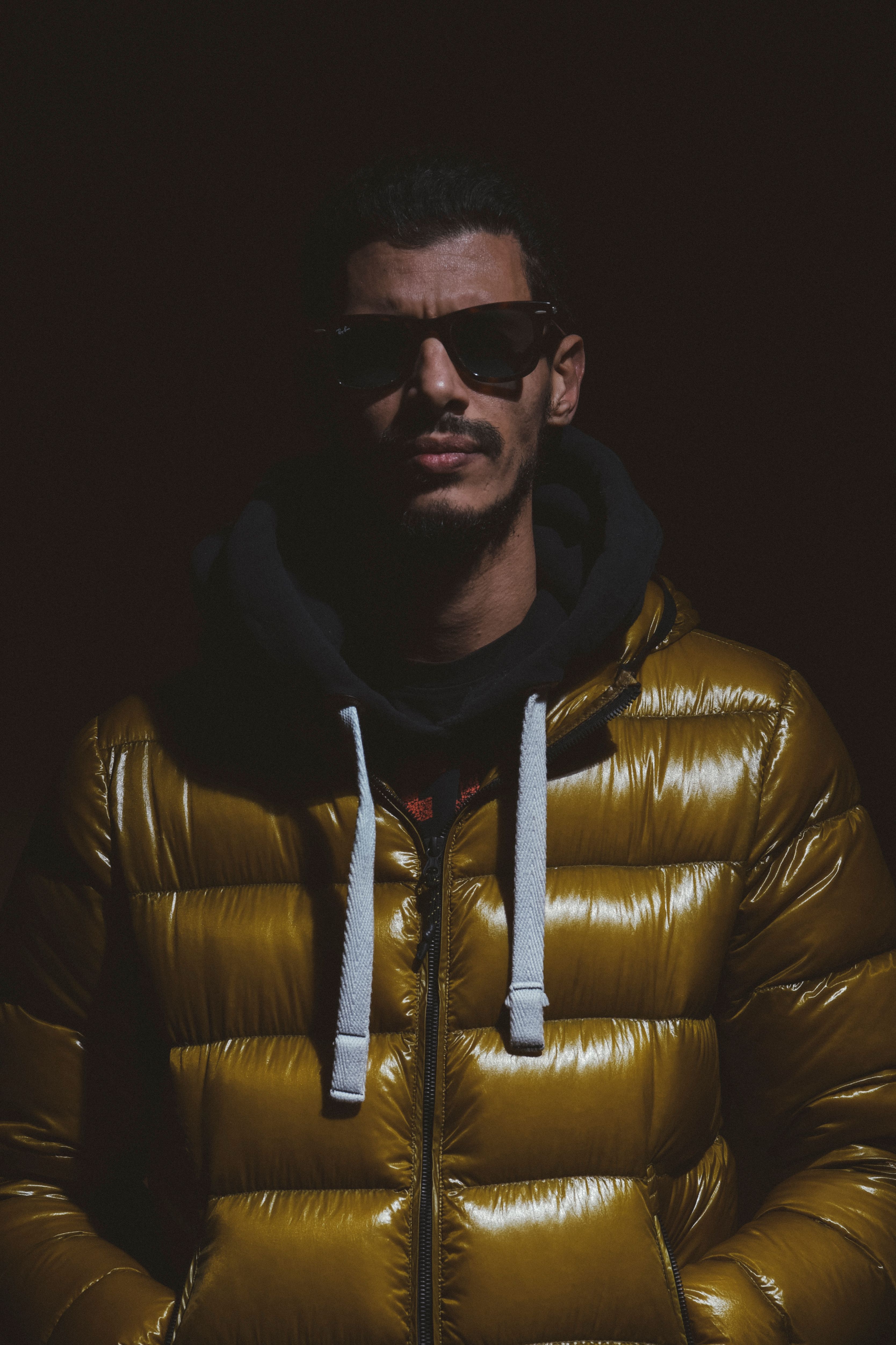 Moody Portrait of Man in Gold Jacket · Free Stock Photo