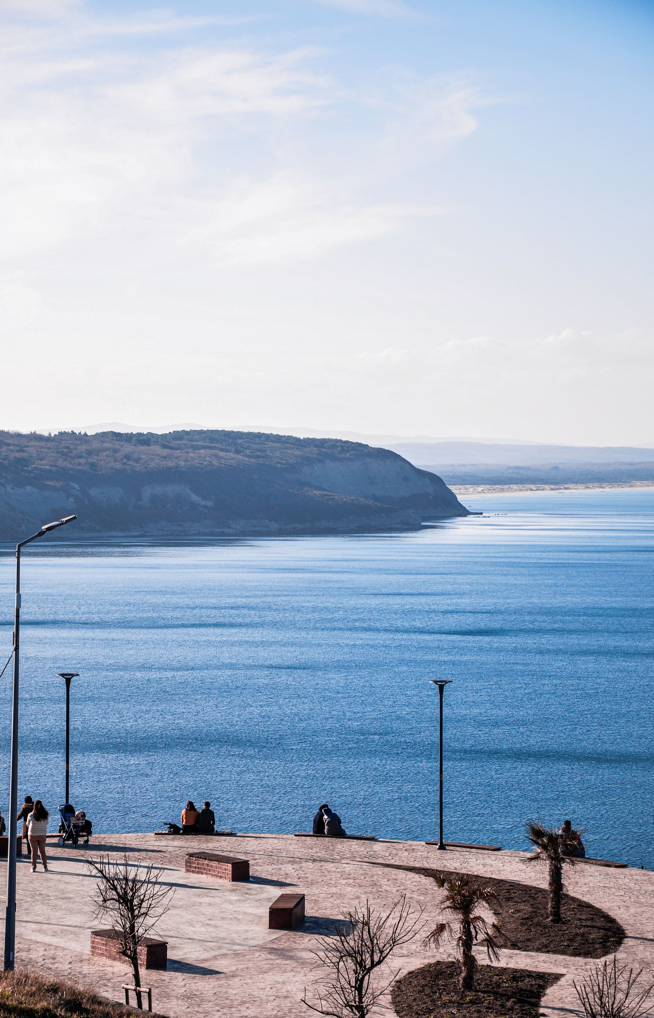Coastal Promenade Overlooking Calm Blue Waters · Free Stock Photo
