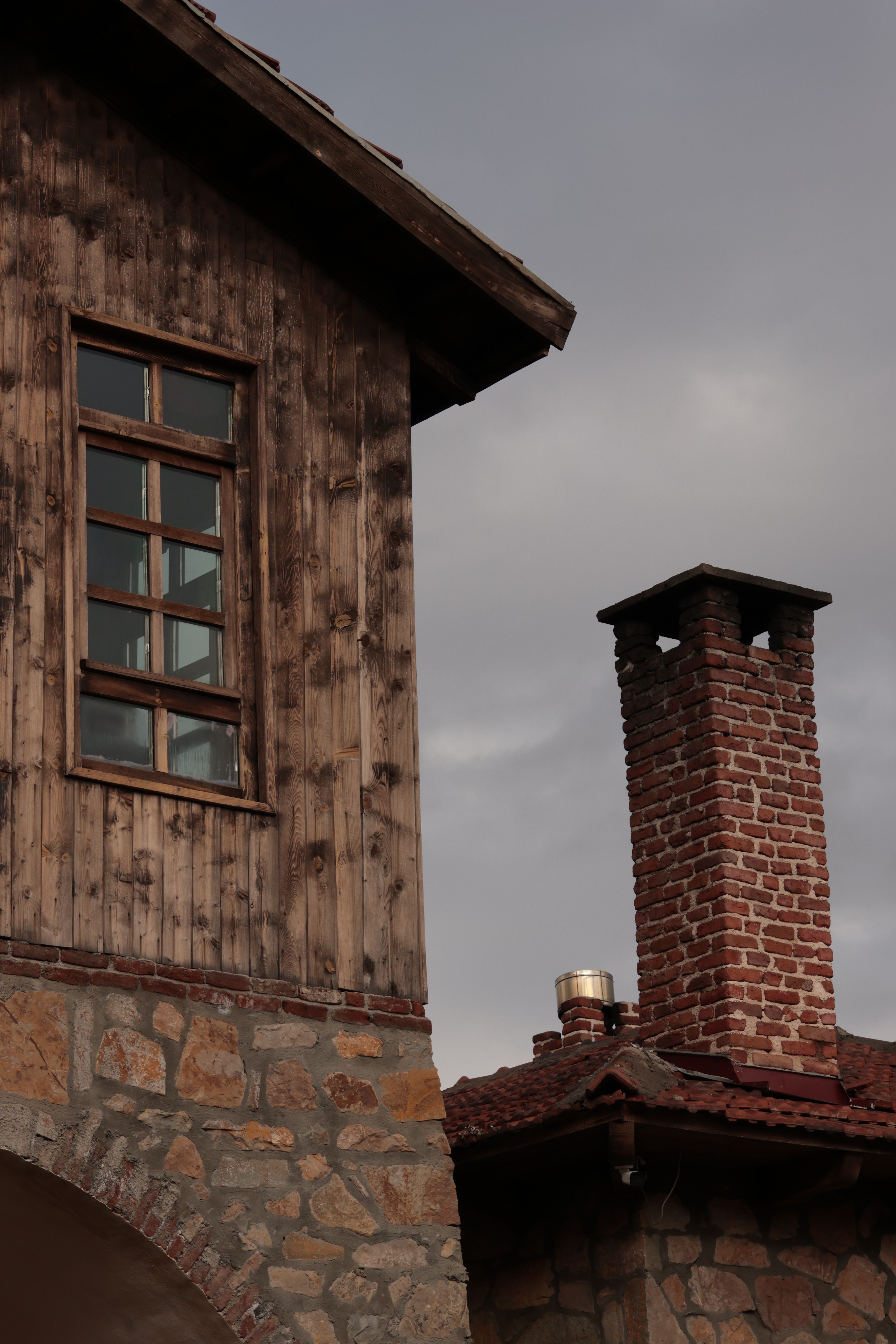 Rustic Wooden House with Brick Chimney · Free Stock Photo