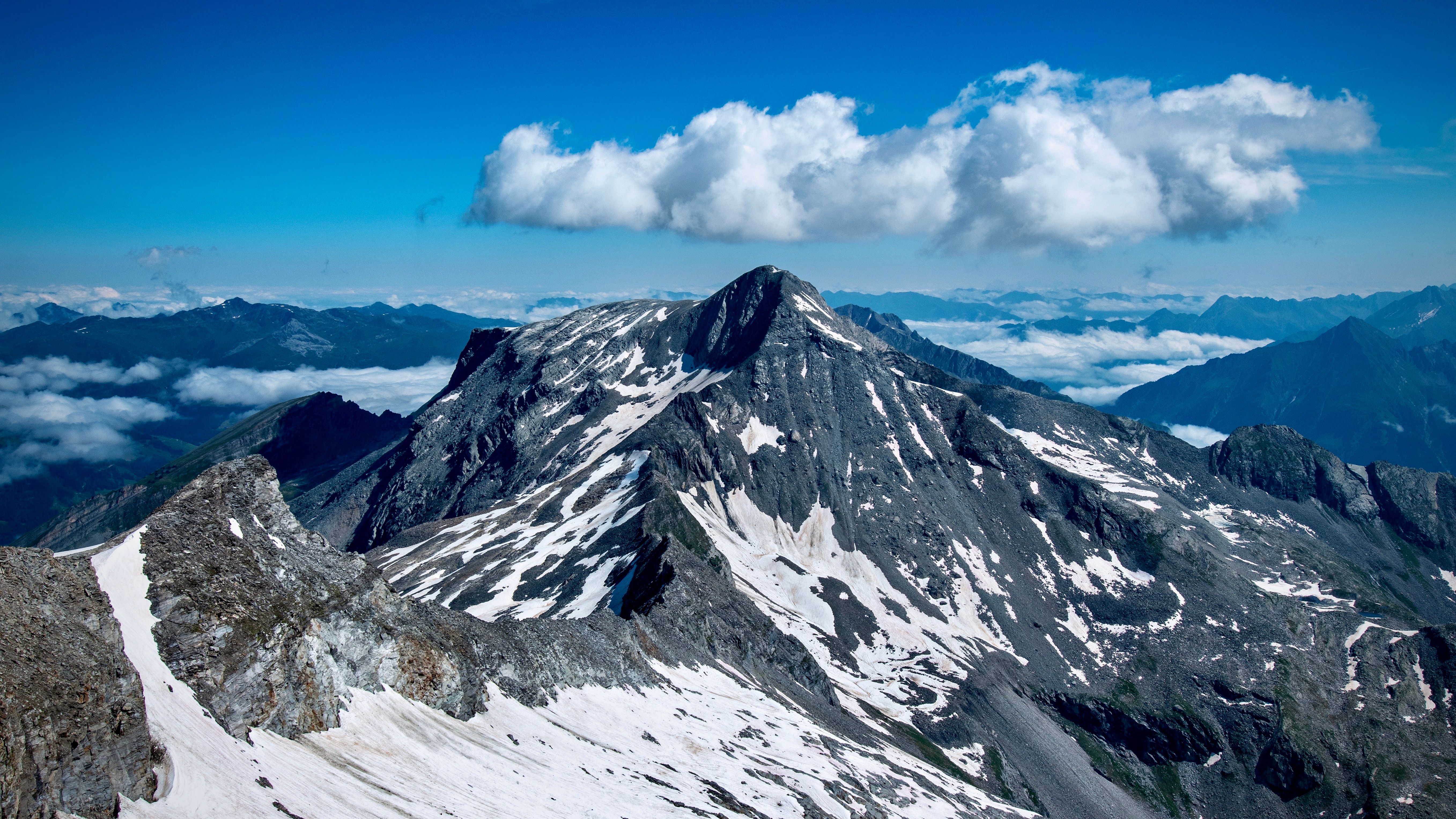 Stunning Alpine Mountain Peak with Snow · Free Stock Photo