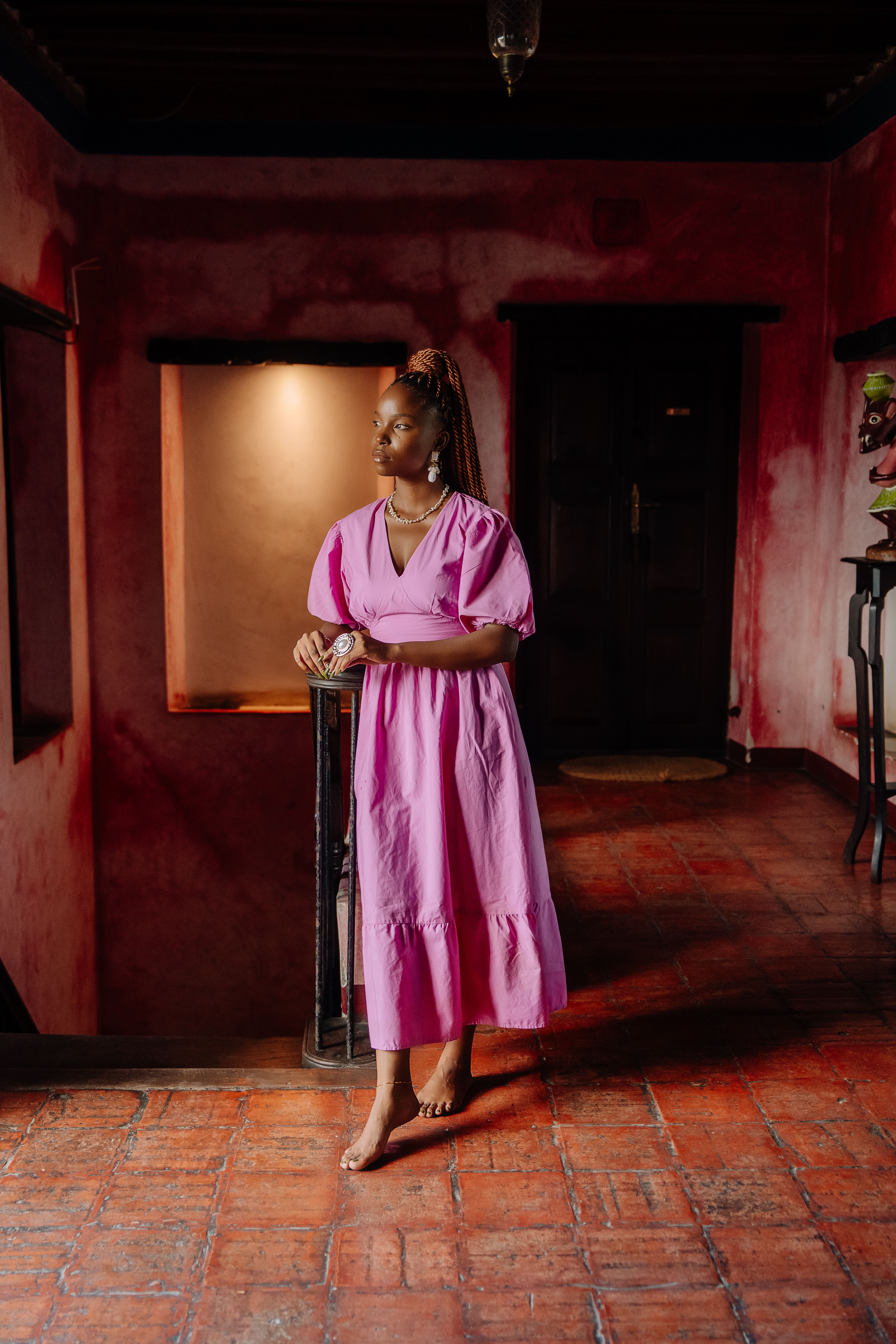 Elegant Woman in Pink Dress at Zanzibar Residence · Free Stock Photo