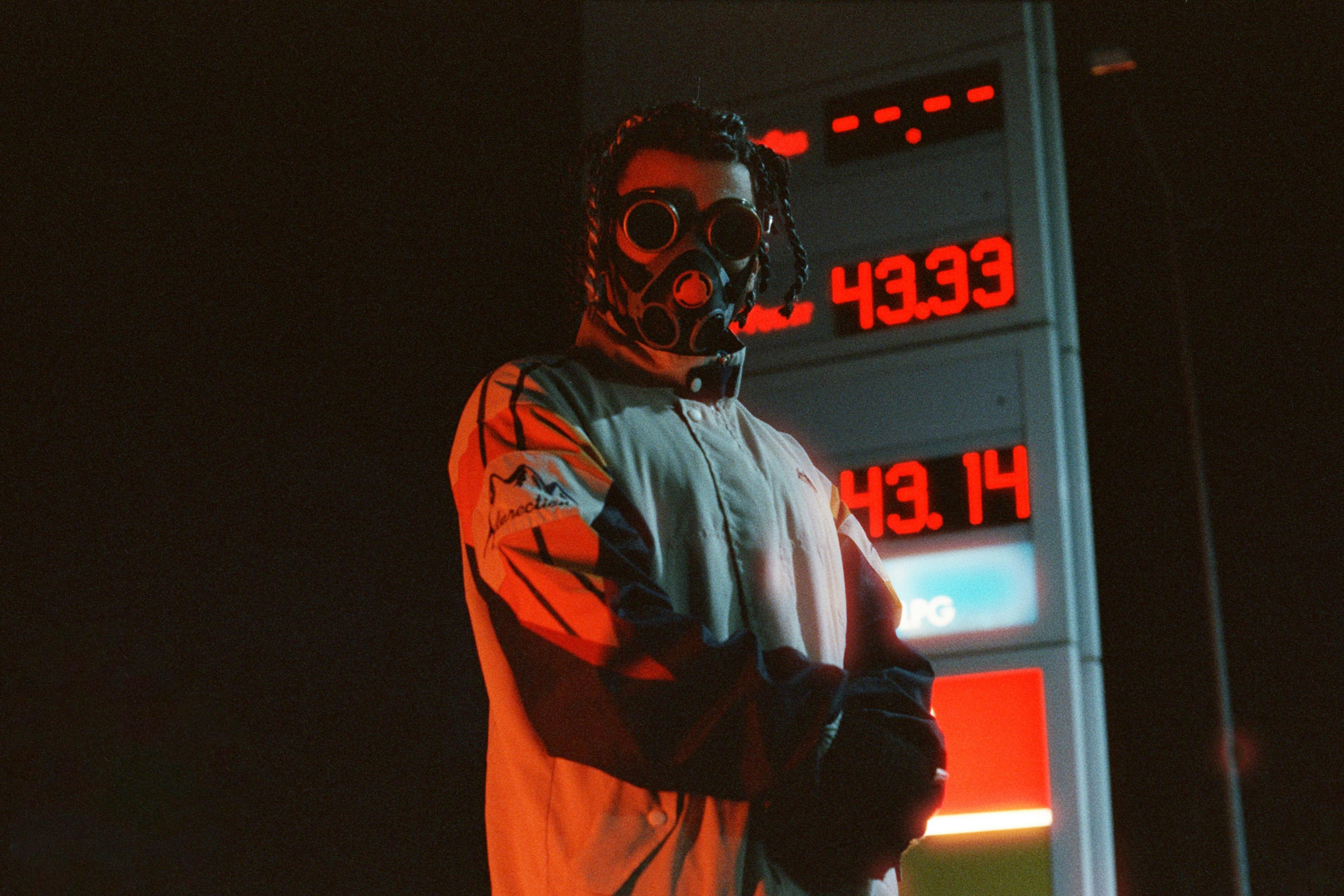 Mysterious Night Scene with Gas Masked Figure · Free Stock Photo