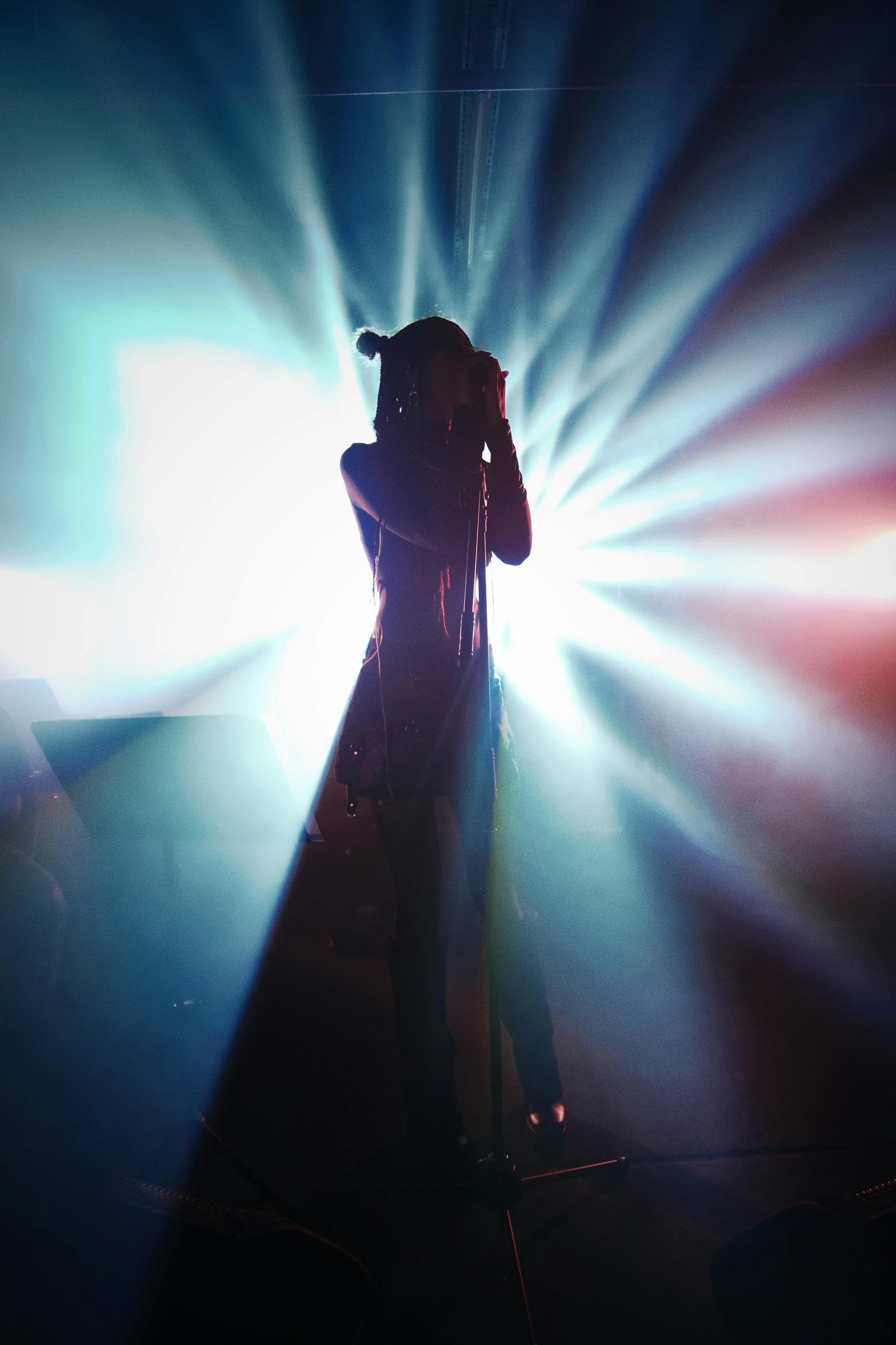 Dramatic Concert Singer in Spotlight Silhouette · Free Stock Photo