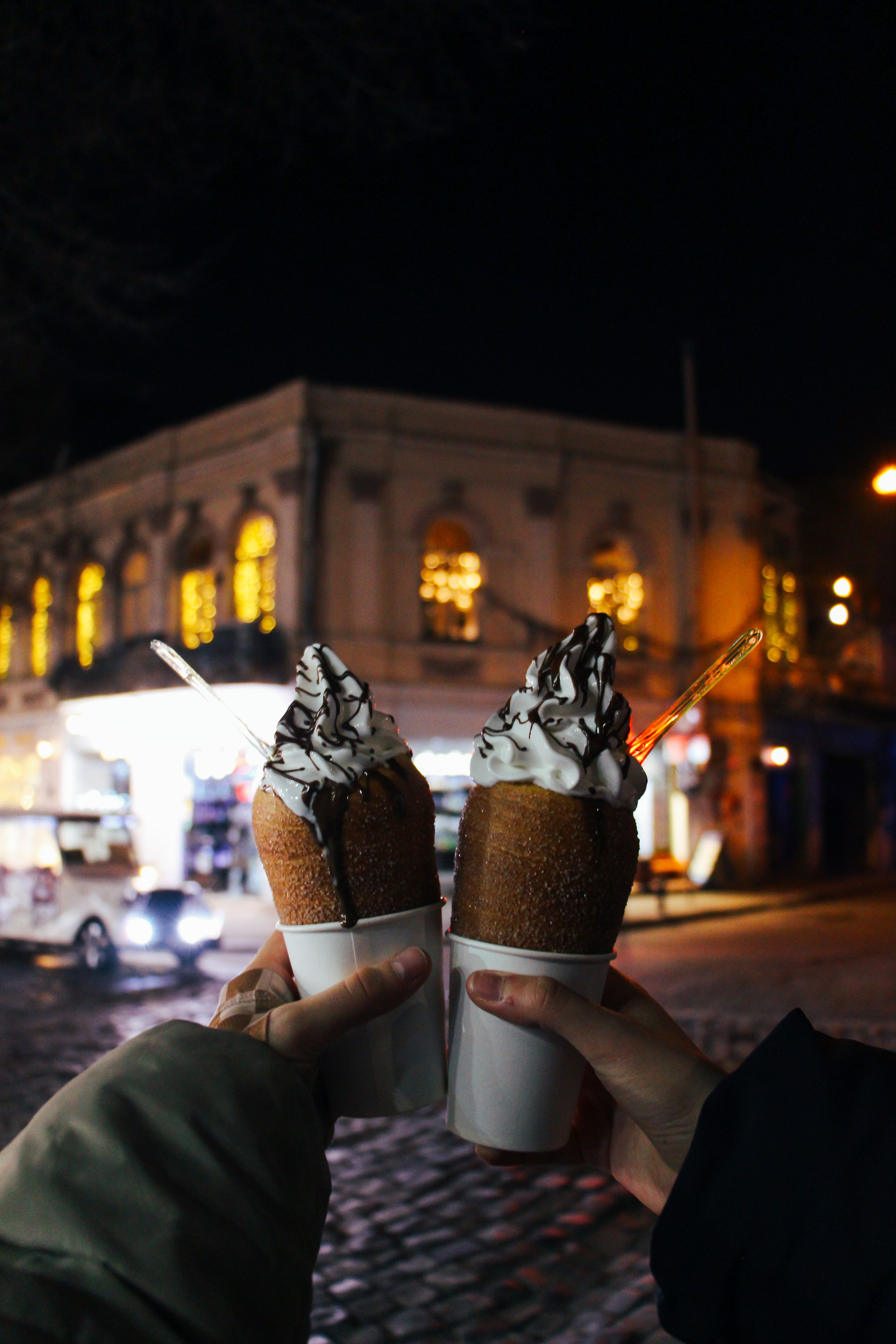 Two Chimney Cakes with Ice Cream at Night in Tbilisi · Free Stock Photo