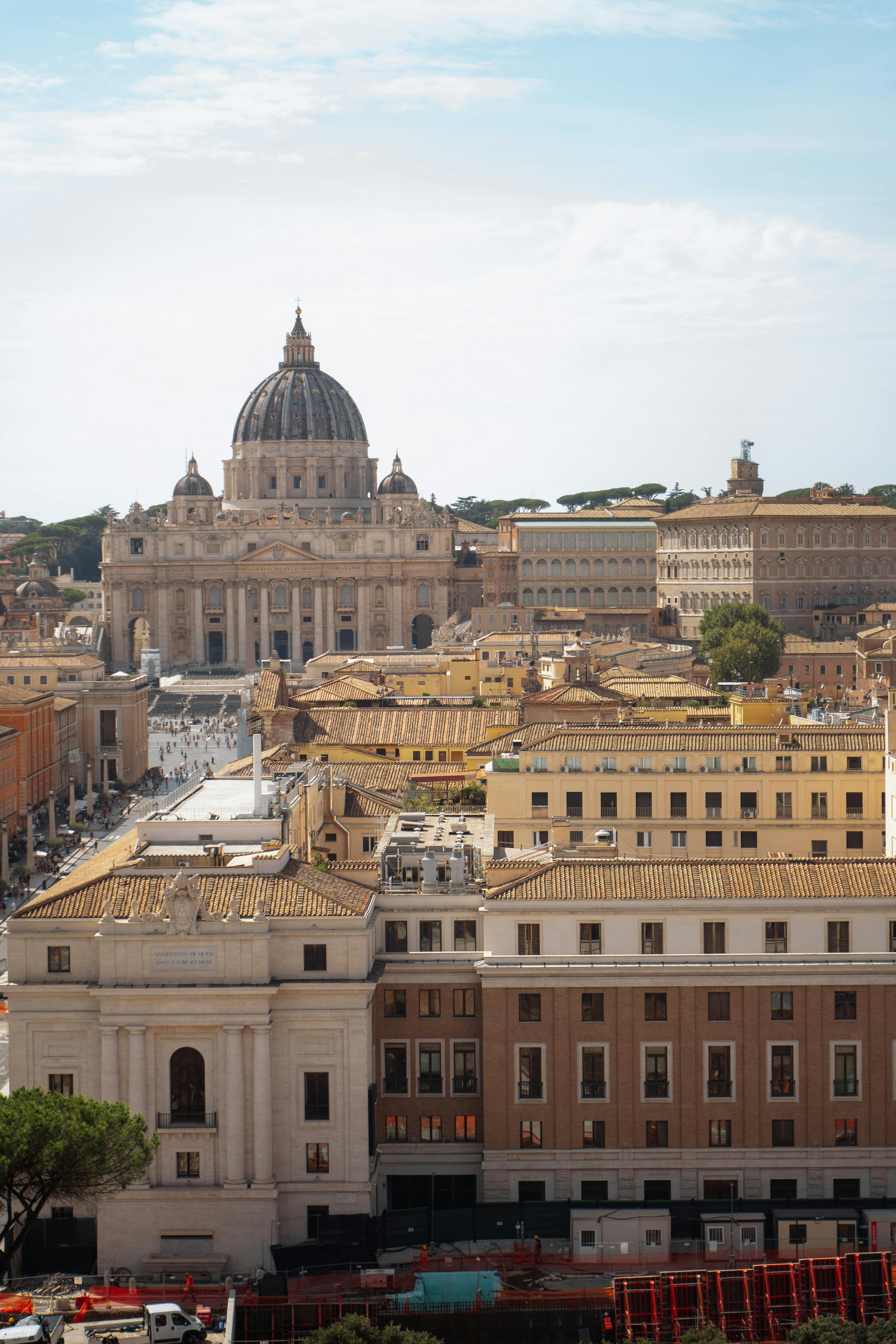 St. Peter's Basilica overlooking Rome rooftops · Free Stock Photo