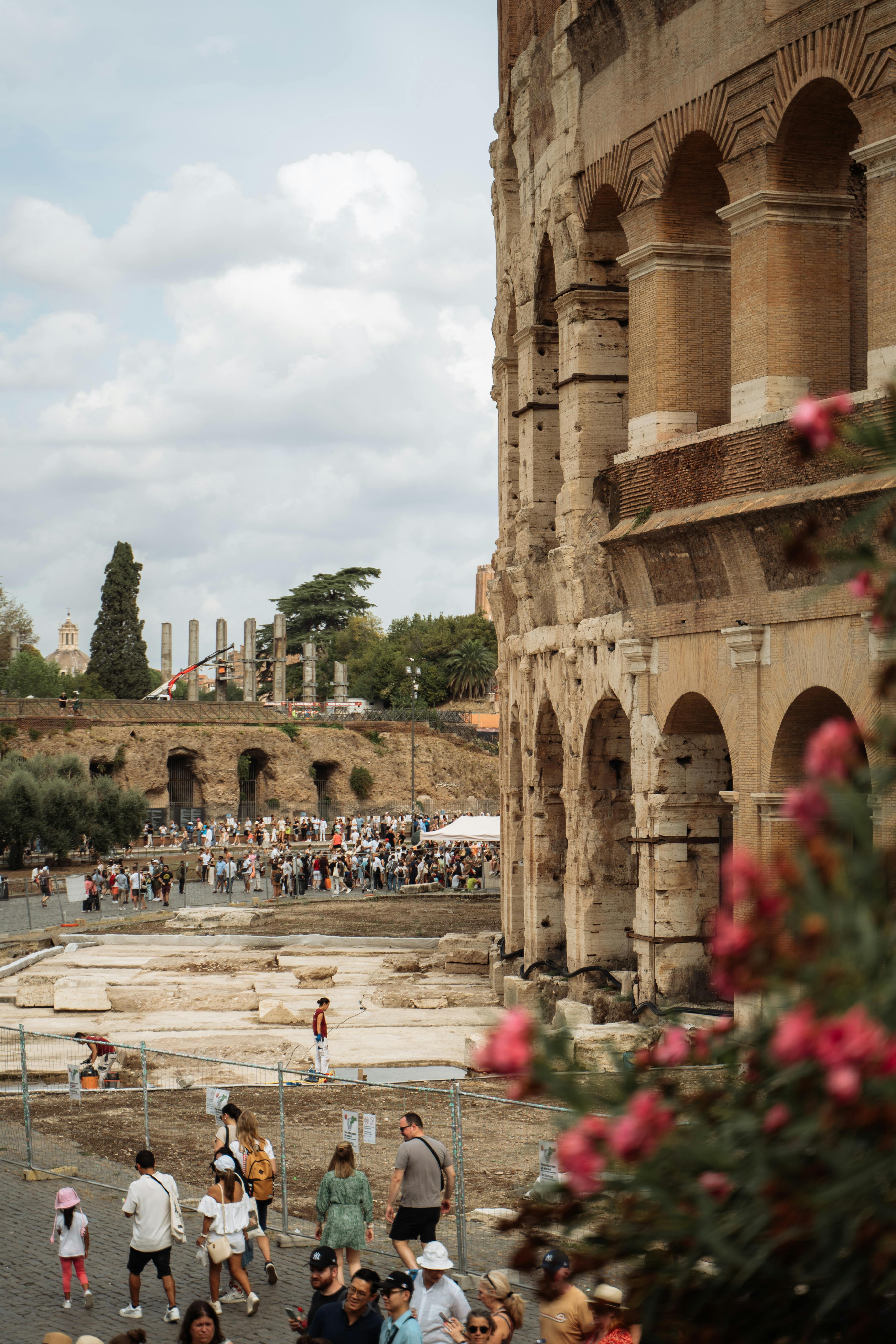 Bustling Scene Near the Colosseum in Rome · Free Stock Photo