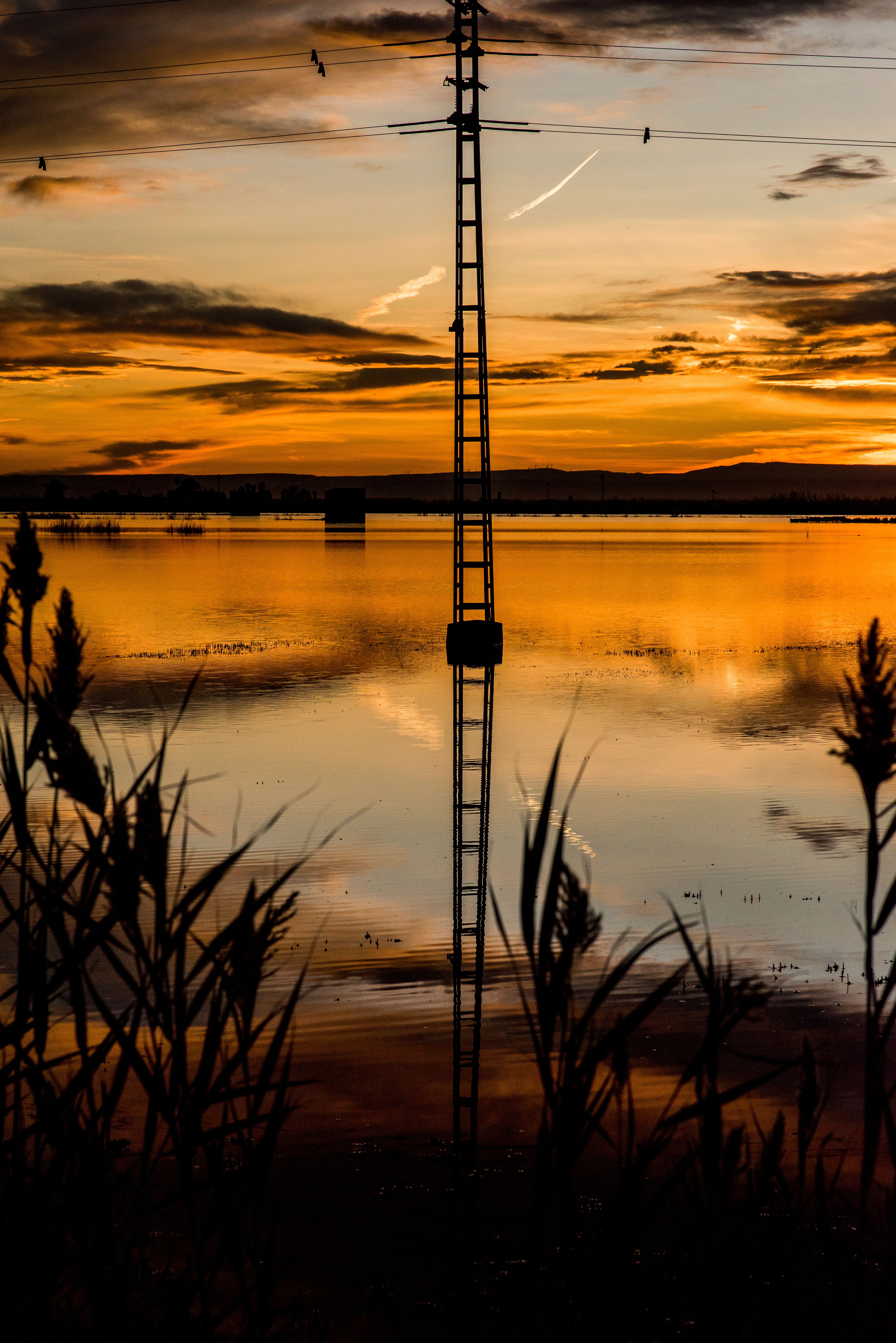 Peaceful Sunset Reflection on Calm Lake Water · Free Stock Photo
