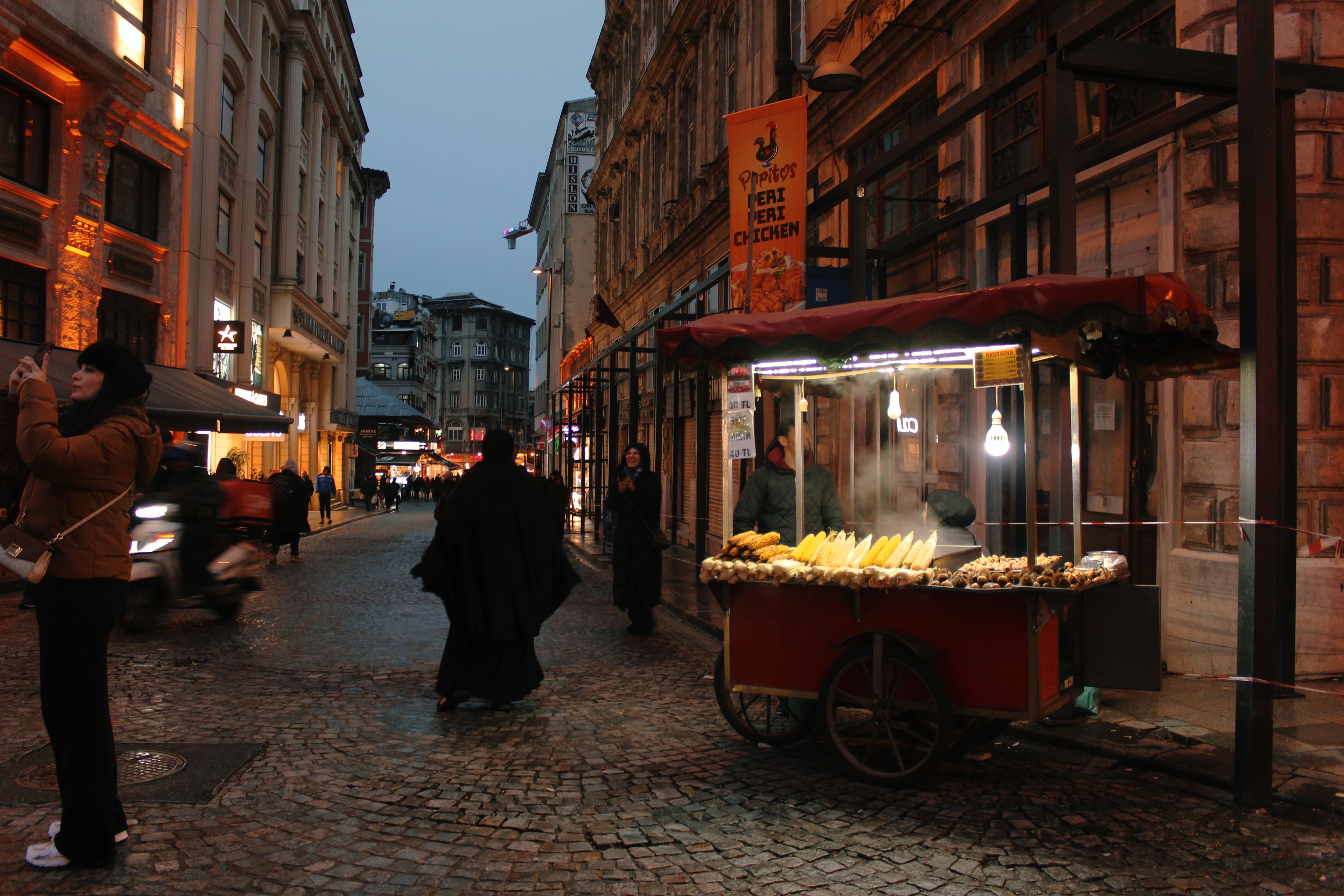 Evening Street Scene with Corn Vendor in Istanbul · Free Stock Photo