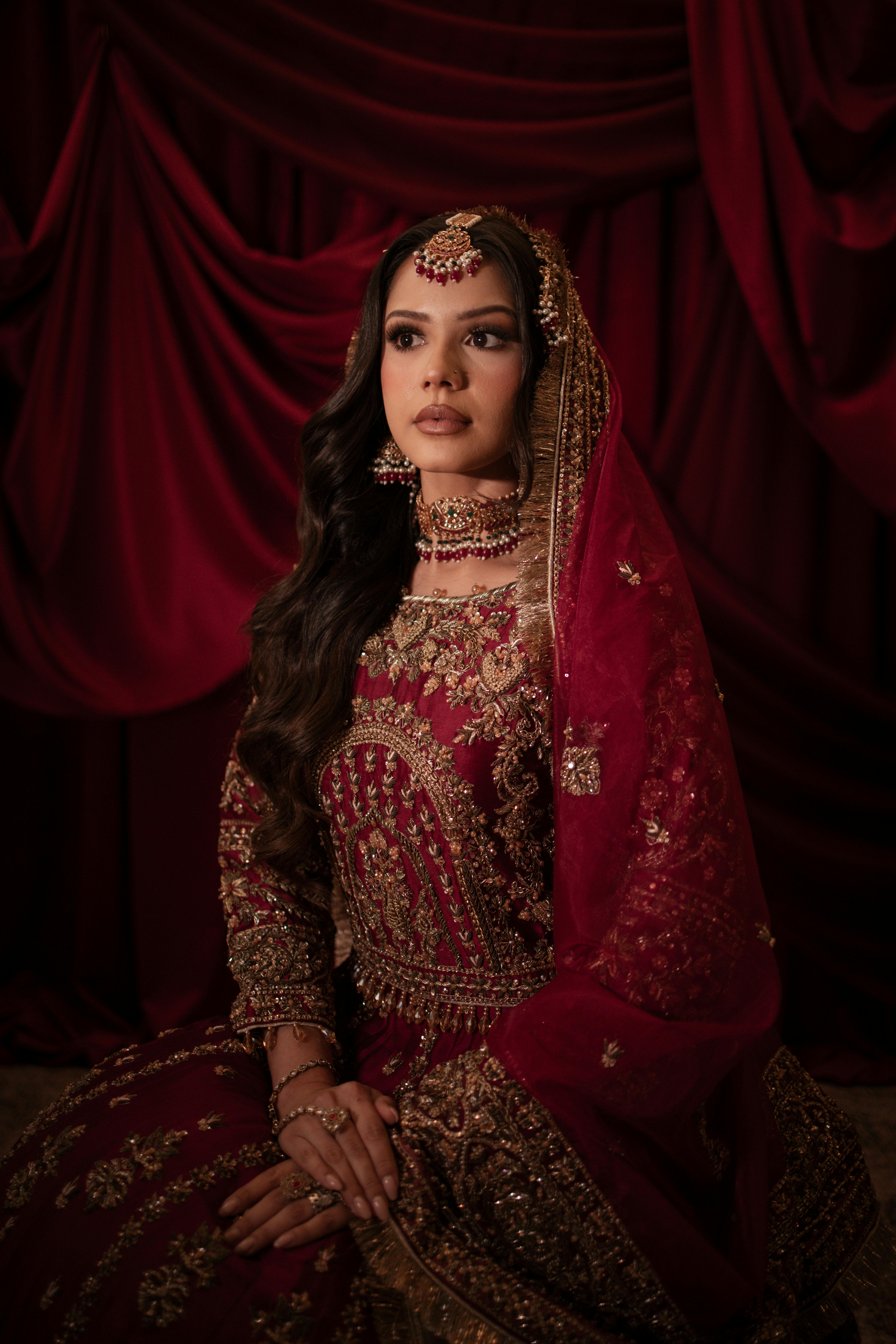 Elegant Bride in Traditional Maroon Attire · Free Stock Photo