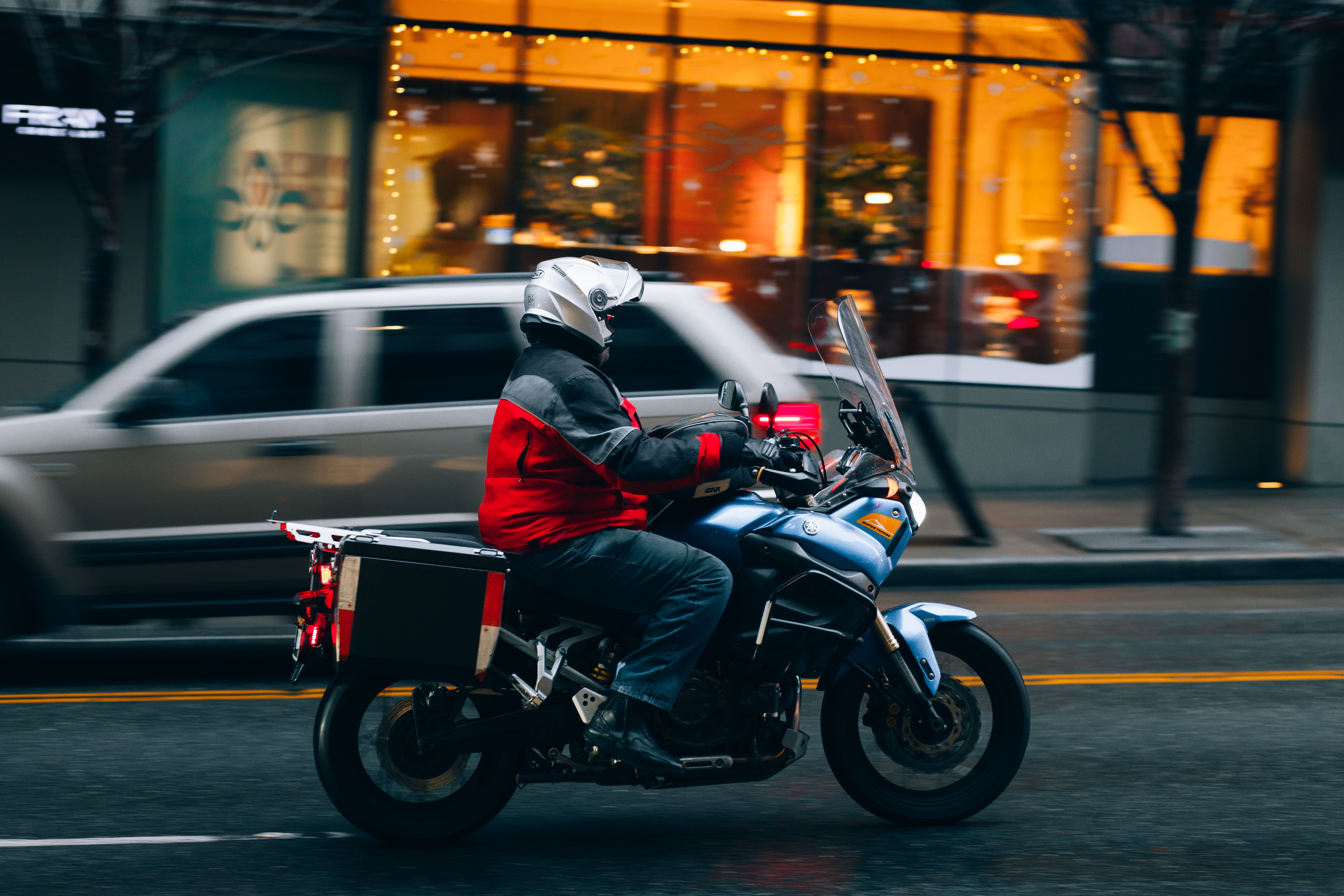 Motorcyclist Riding Through Seattle Street · Free Stock Photo