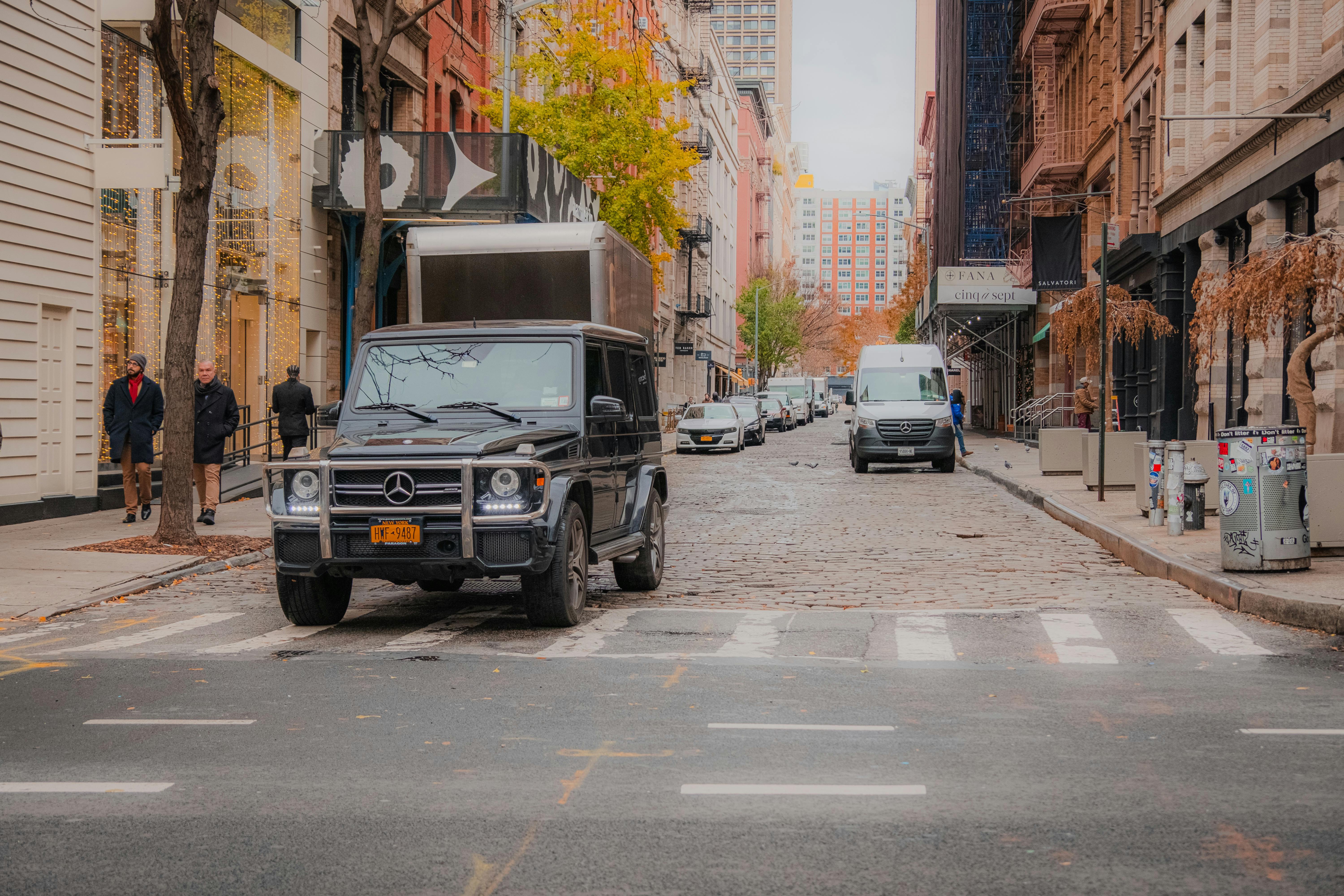 Urban Street Scene with Mercedes Vehicles · Free Stock Photo