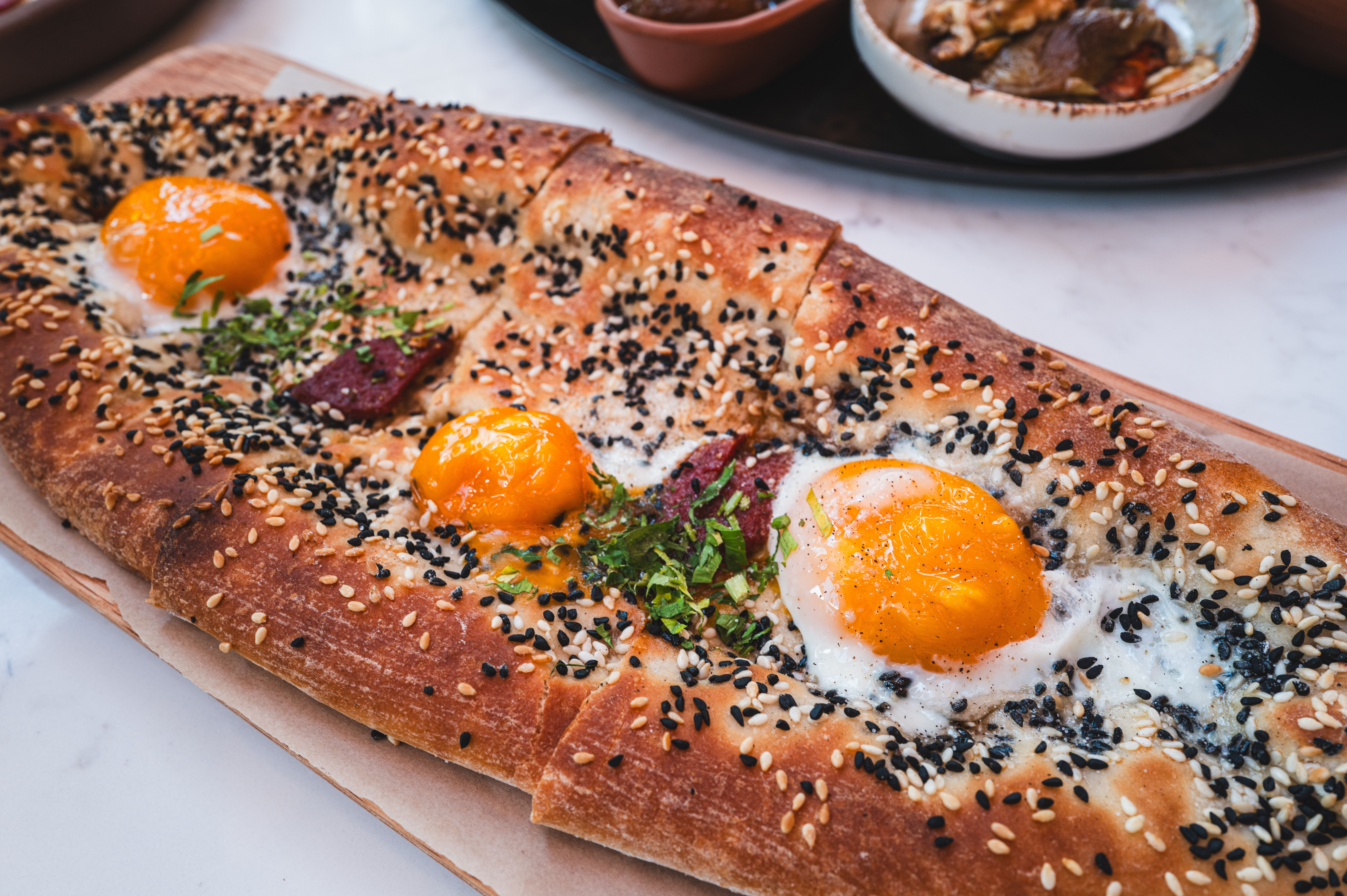 Delicious Turkish Pide with Eggs and Spices · Free Stock Photo