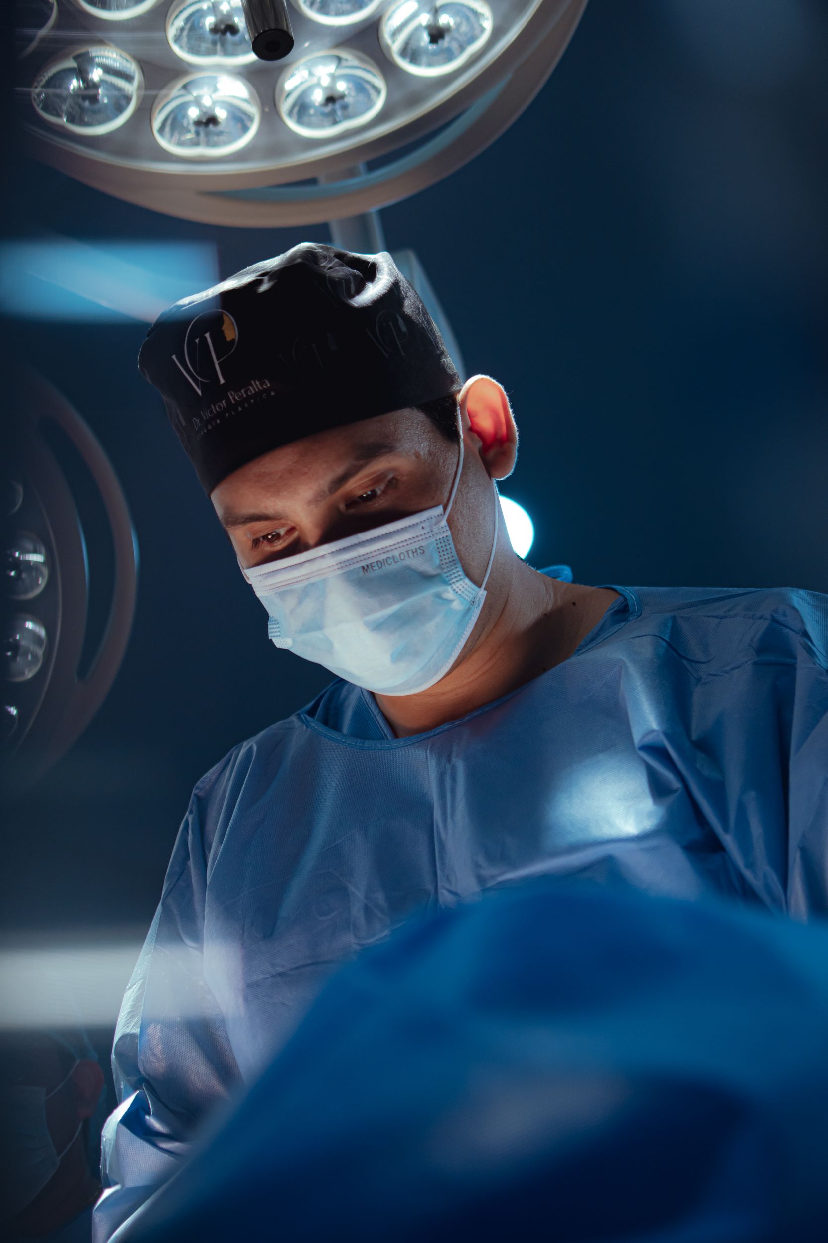 Surgeon in Operating Room Performing Surgery · Free Stock Photo
