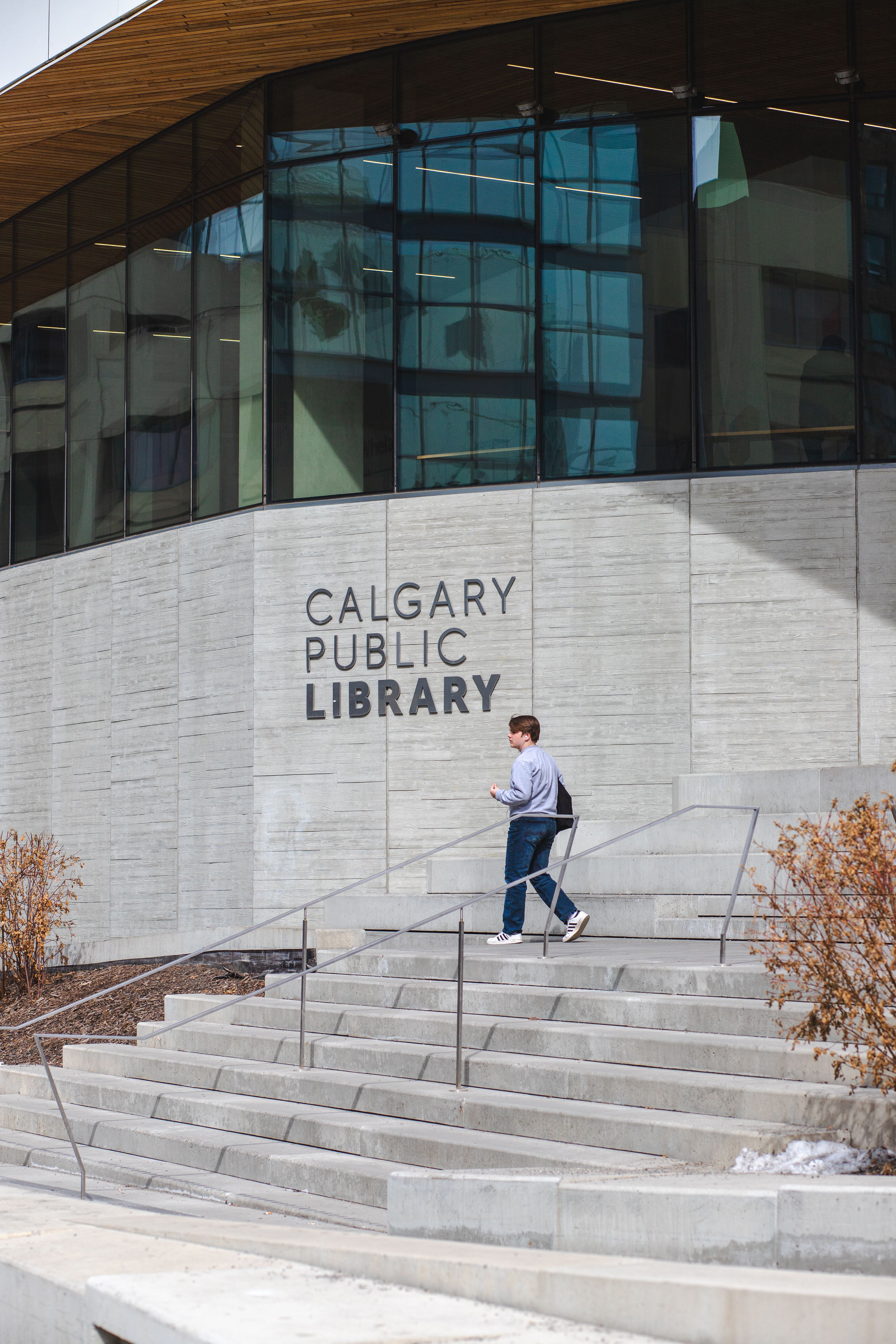 Visitor at Calgary Public Library Entrance · Free Stock Photo
