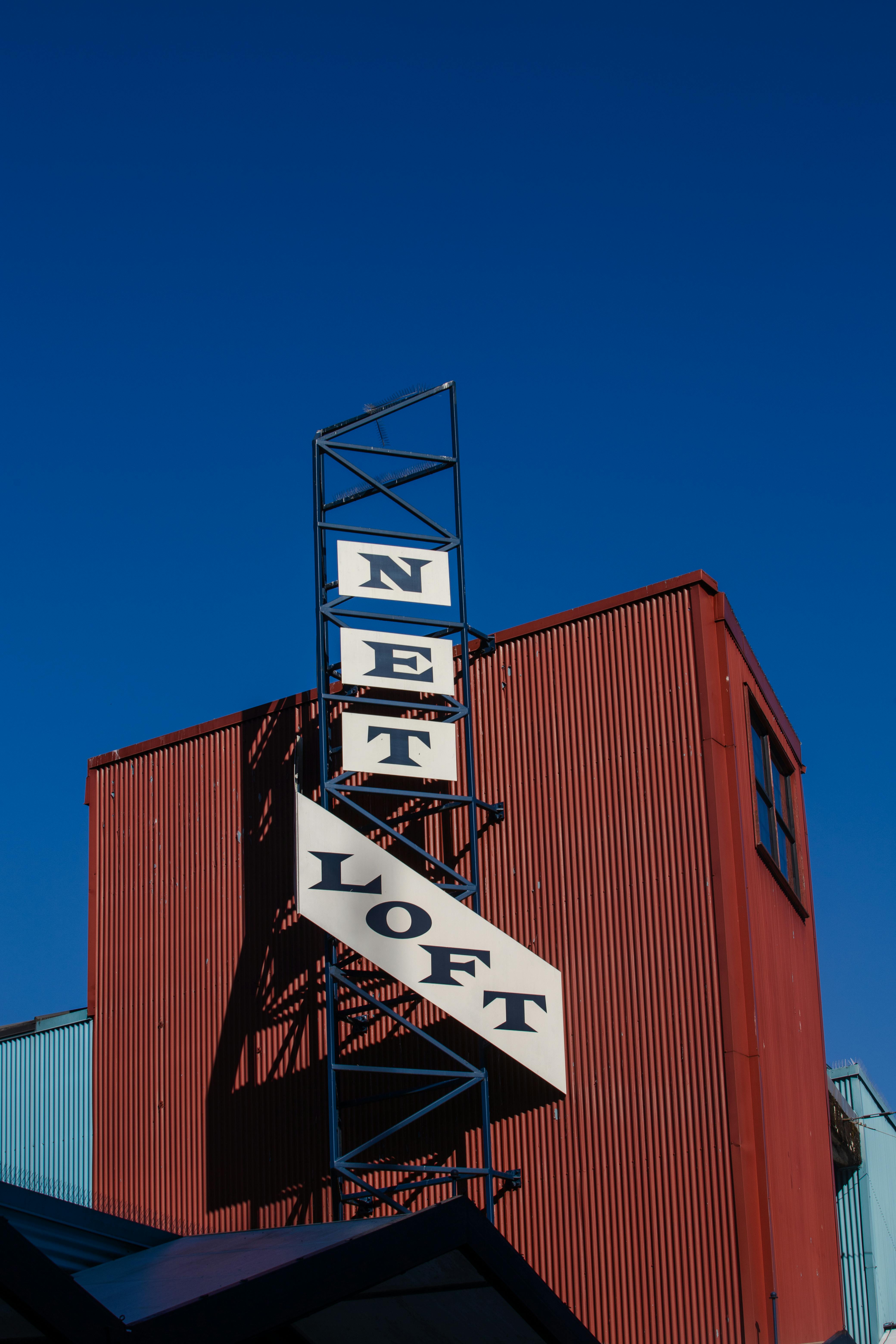 Colorful Industrial Building with Net Loft Sign · Free Stock Photo