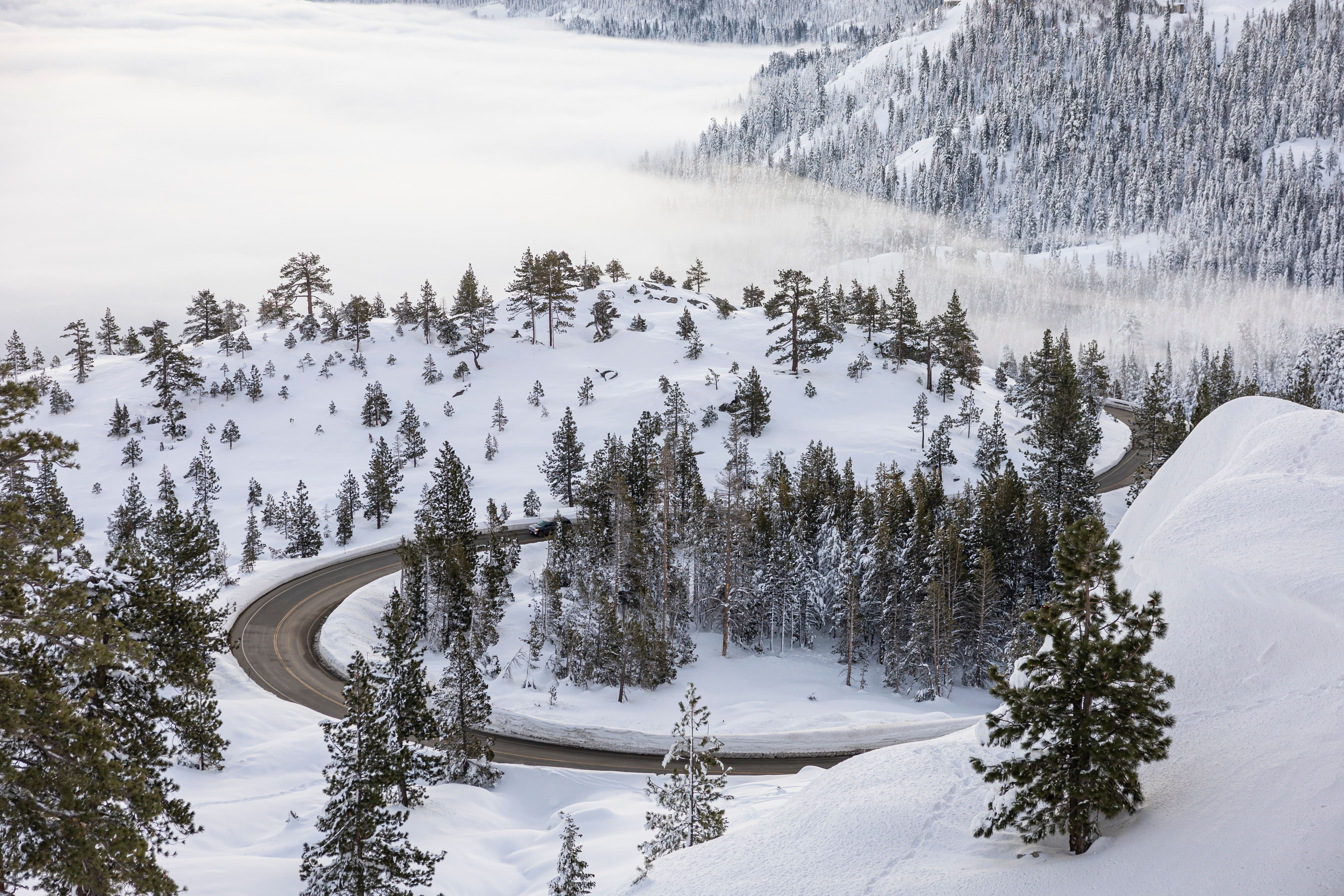 A Scenic Winter View of Snowy Donner Pass Road · Free Stock Photo