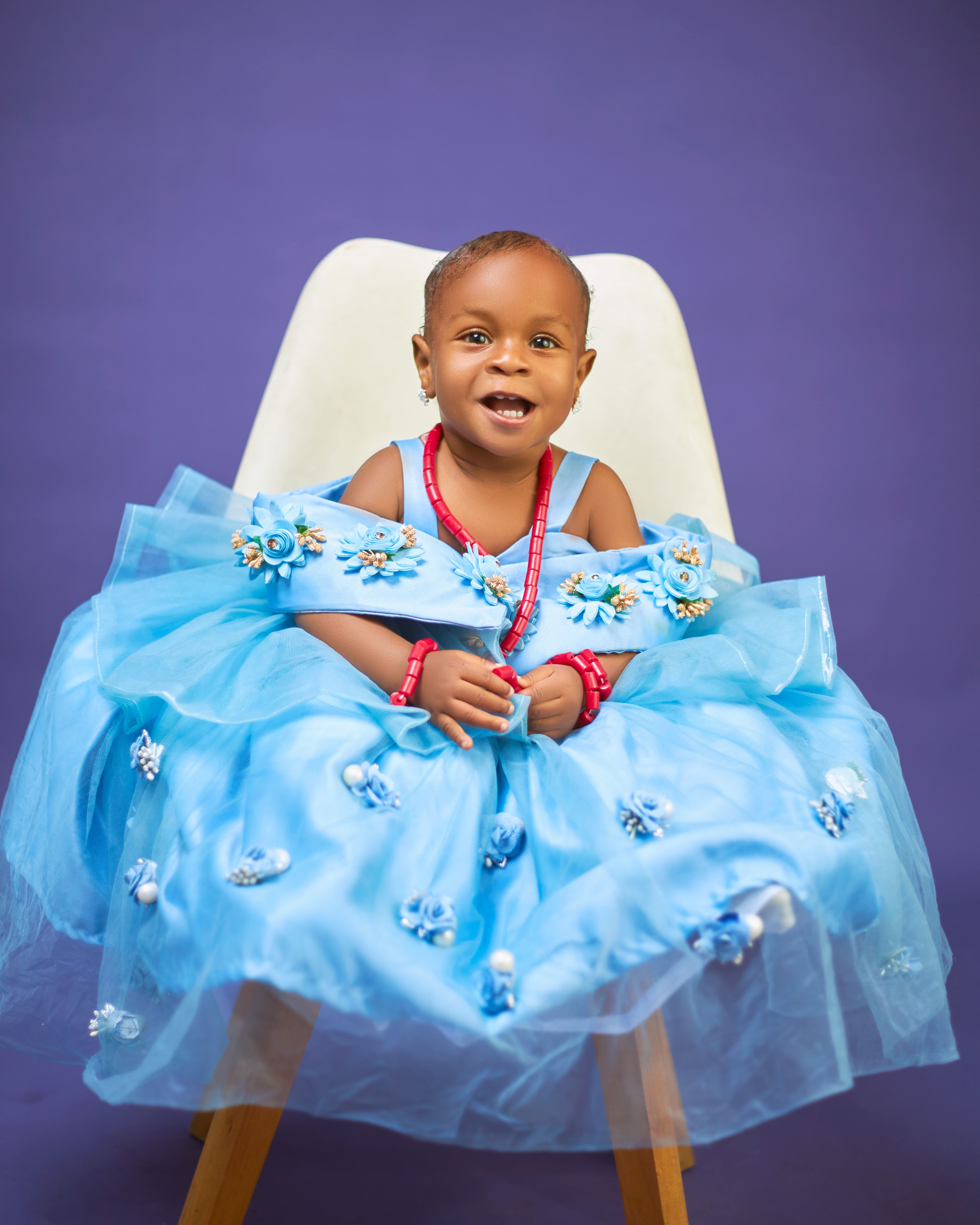 Adorable Baby in a Blue Dress Portrait · Free Stock Photo