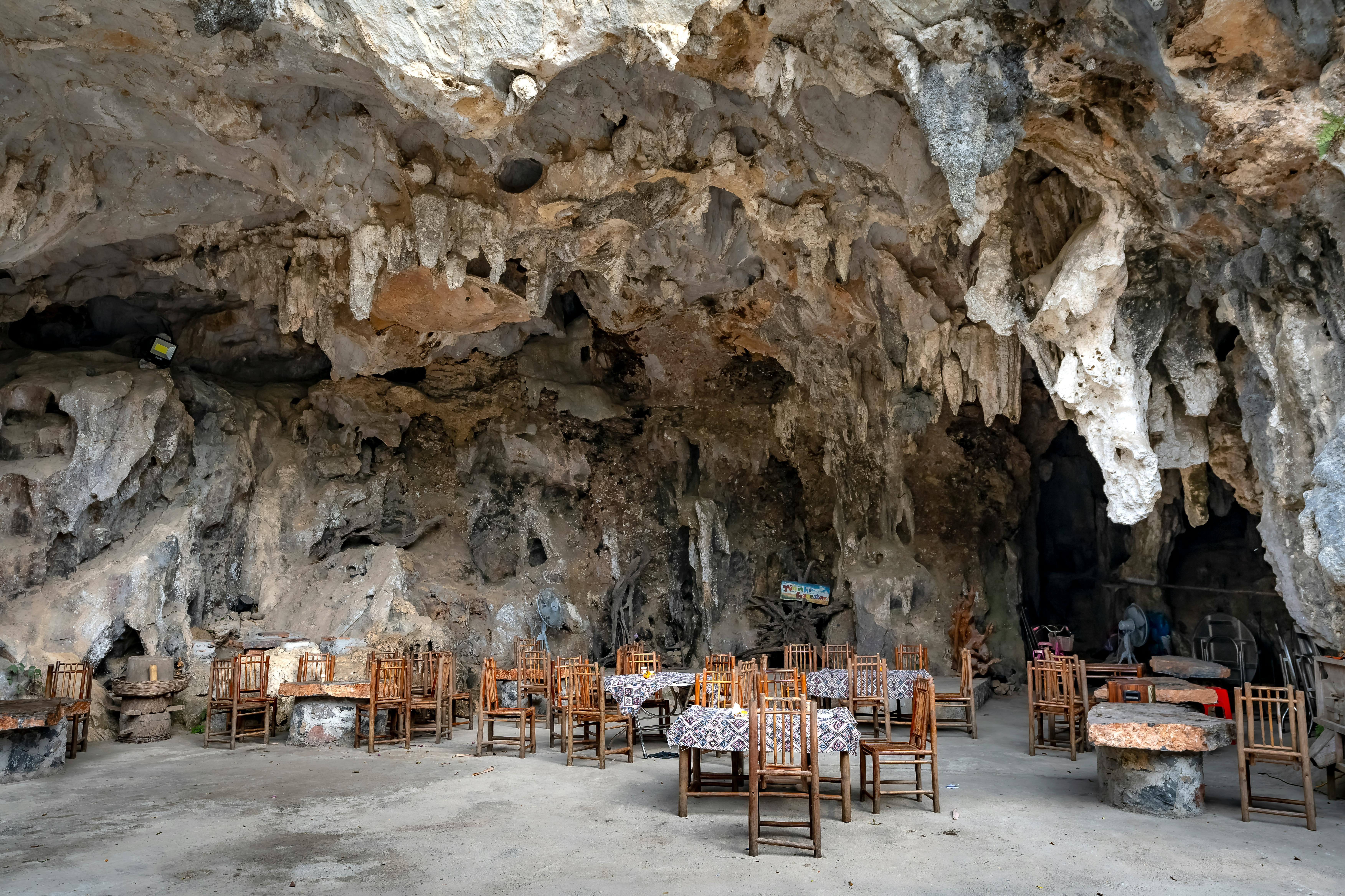 Rustic Cave Restaurant with Wooden Chairs and Tables · Free Stock Photo