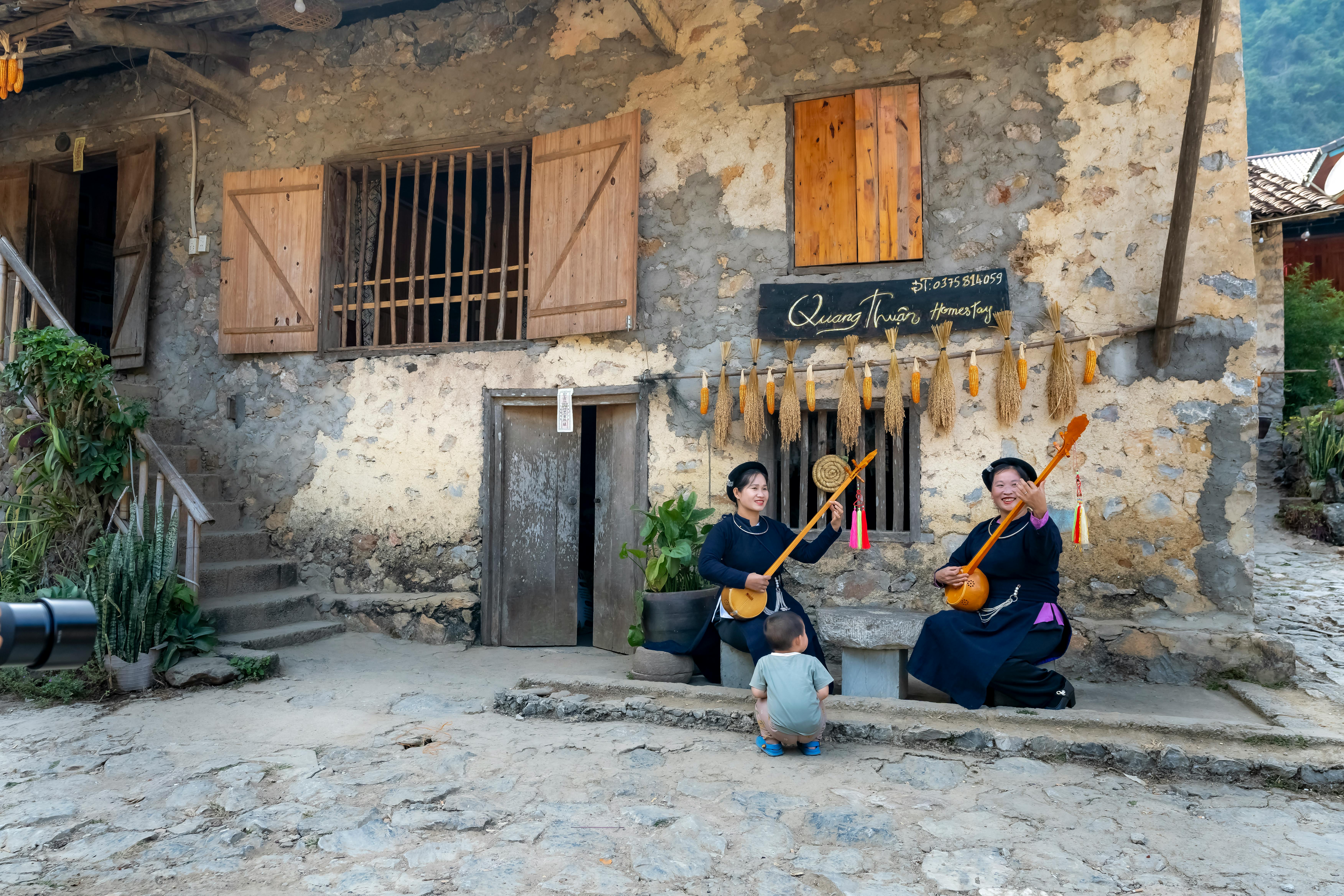 Traditional Music Performance in Rustic Village Setting · Free Stock Photo