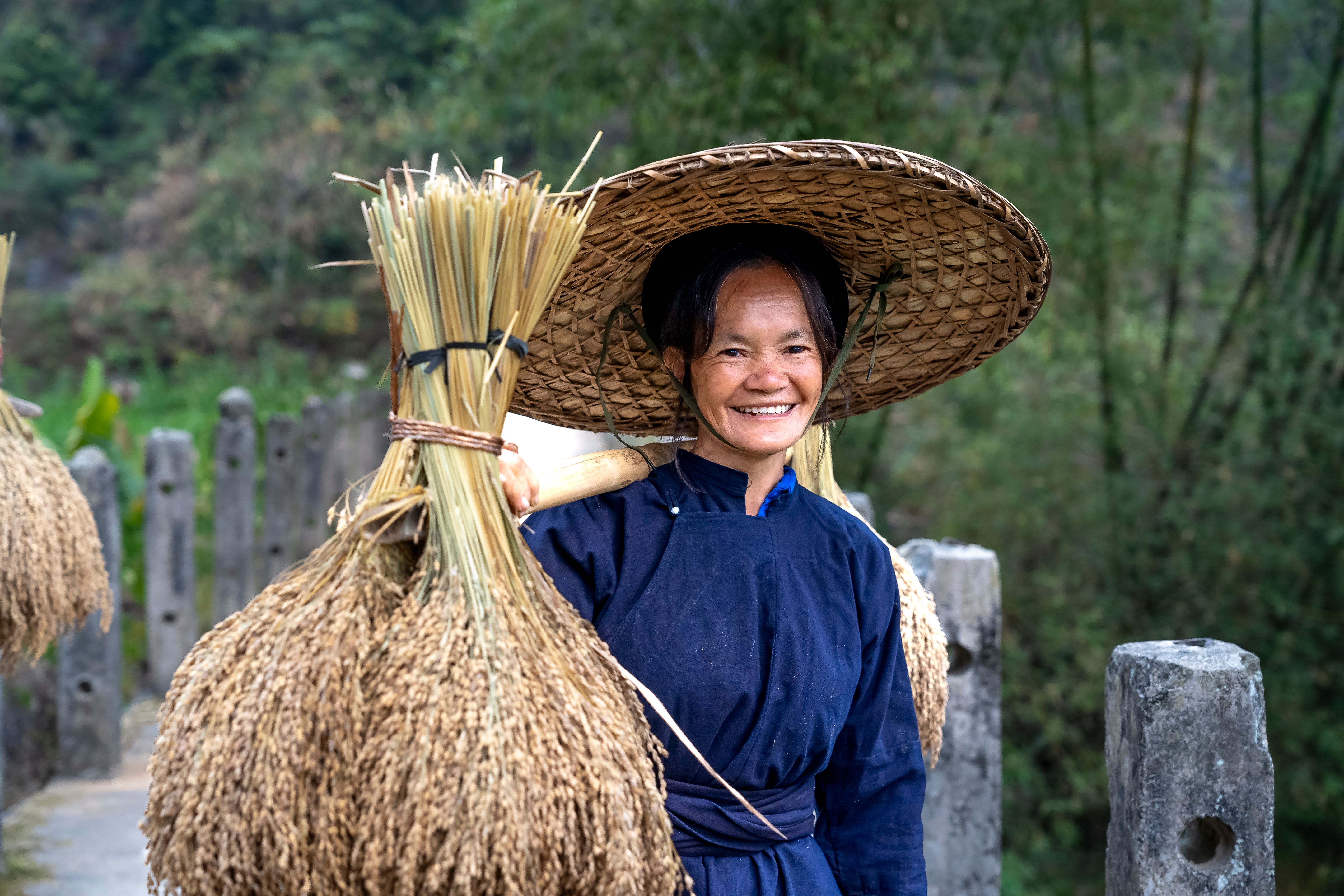 Smiling Woman in Traditional Rural Setting · Free Stock Photo