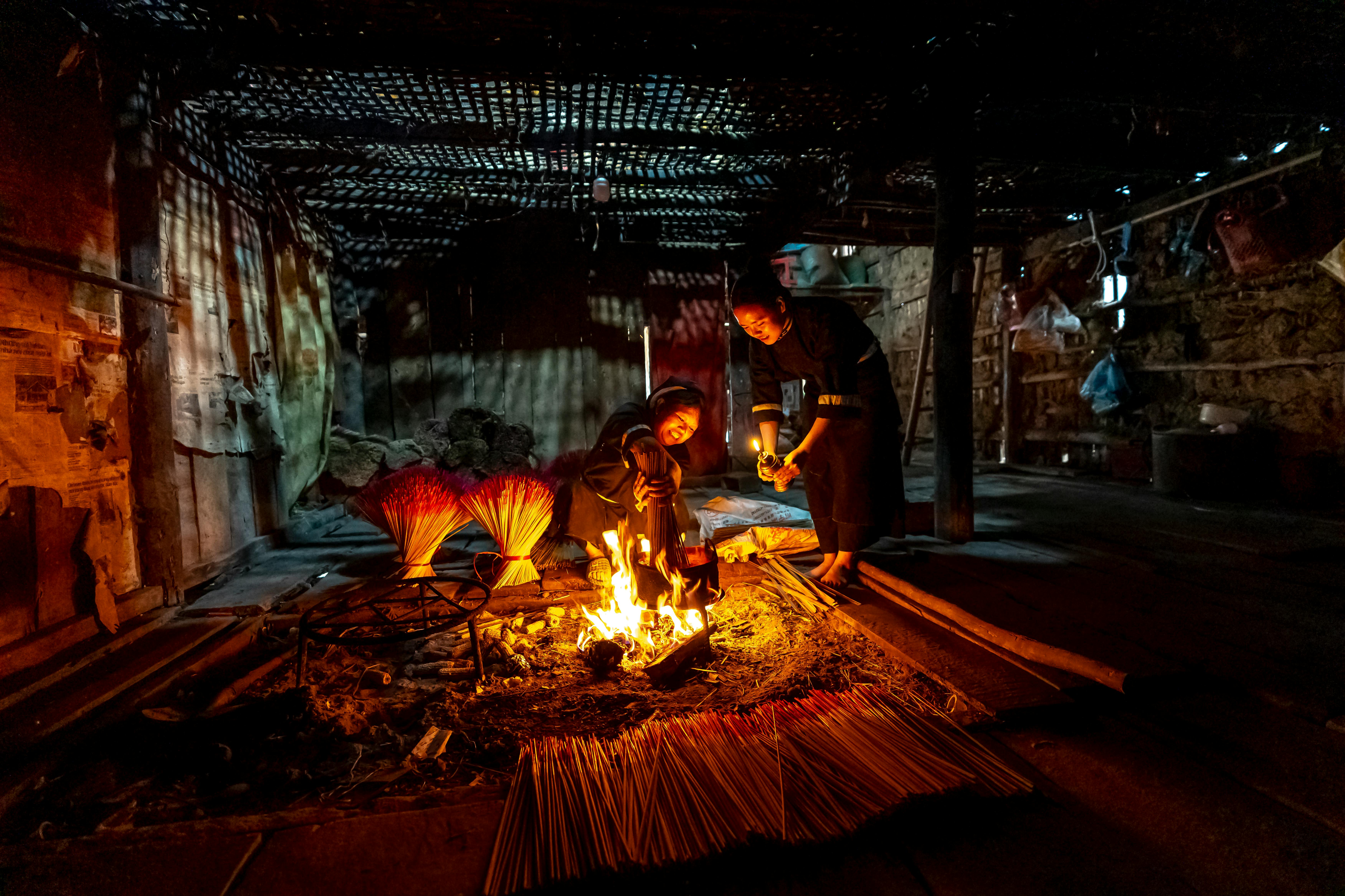 Intimate Moment by Firelight in Rustic Interior · Free Stock Photo