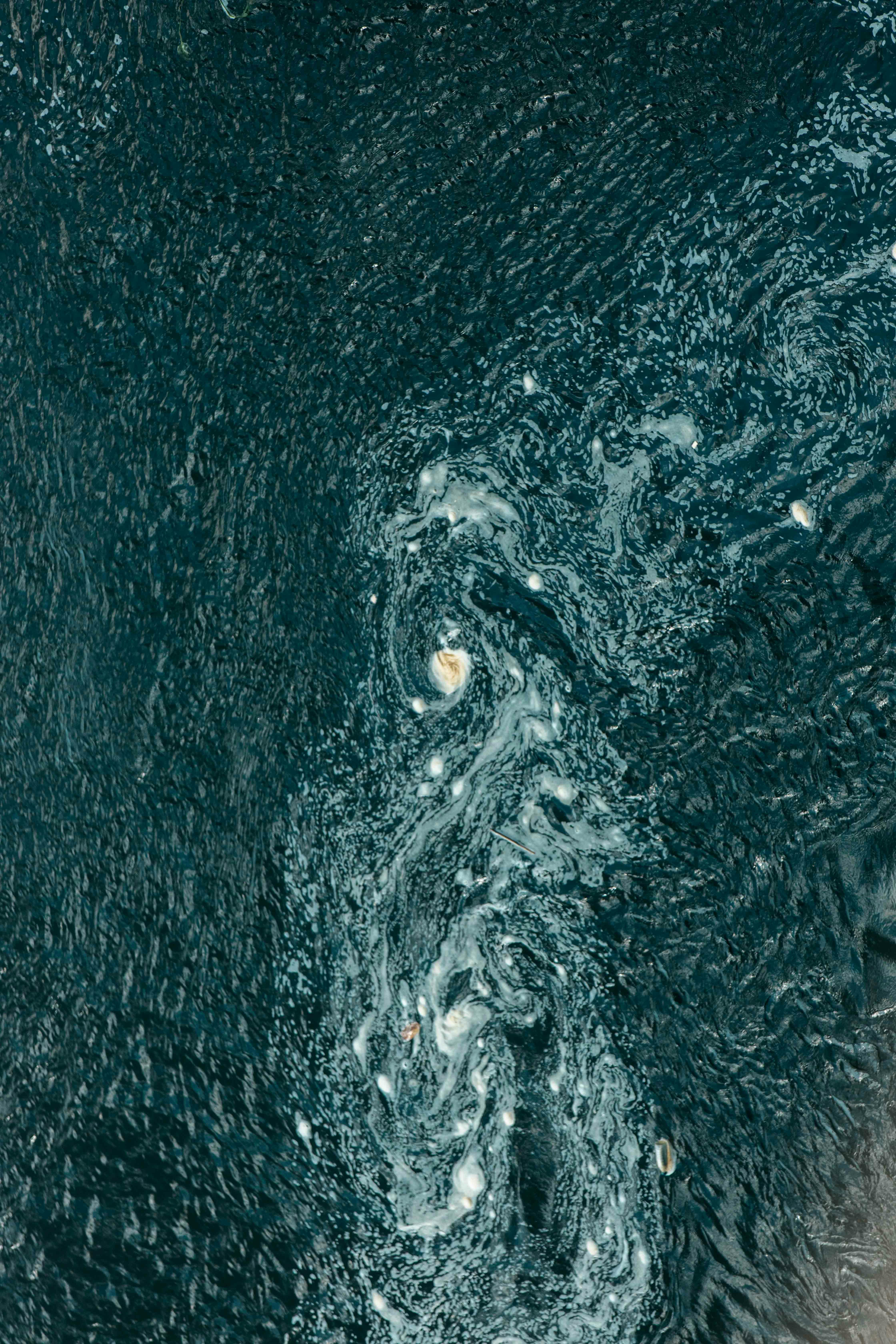 Abstract swirling ocean texture aerial view · Free Stock Photo